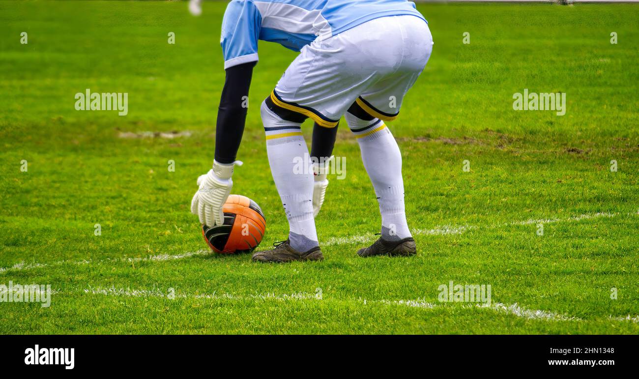 Blurred view of professional football or soccer goalkeeper in action on ...