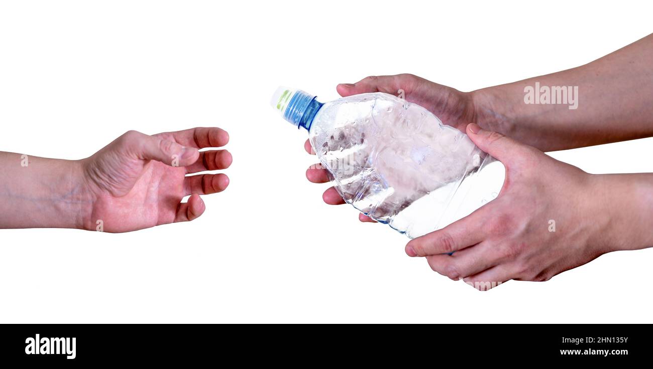 A man passes an empty, plastic bottle, isolated on a white background ...
