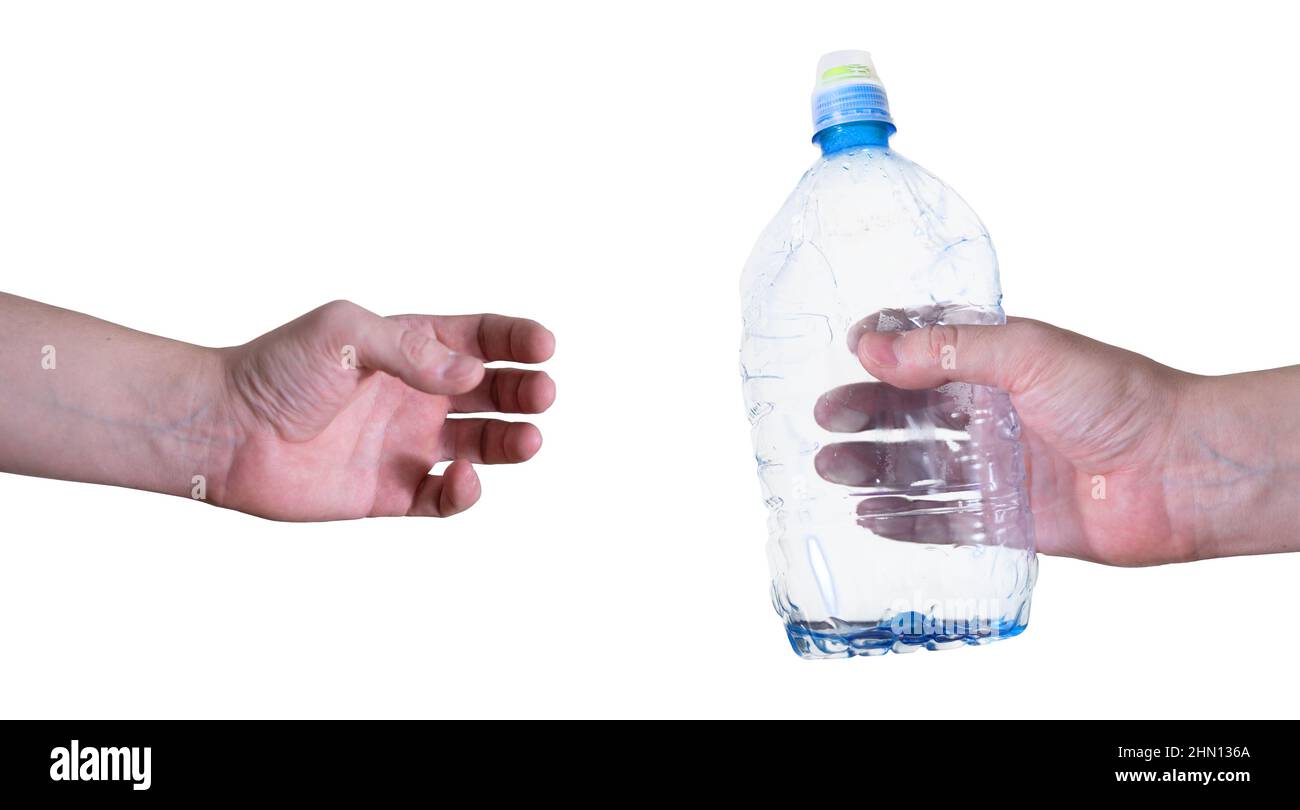 A man passes an empty, plastic bottle, isolated on a white background ...