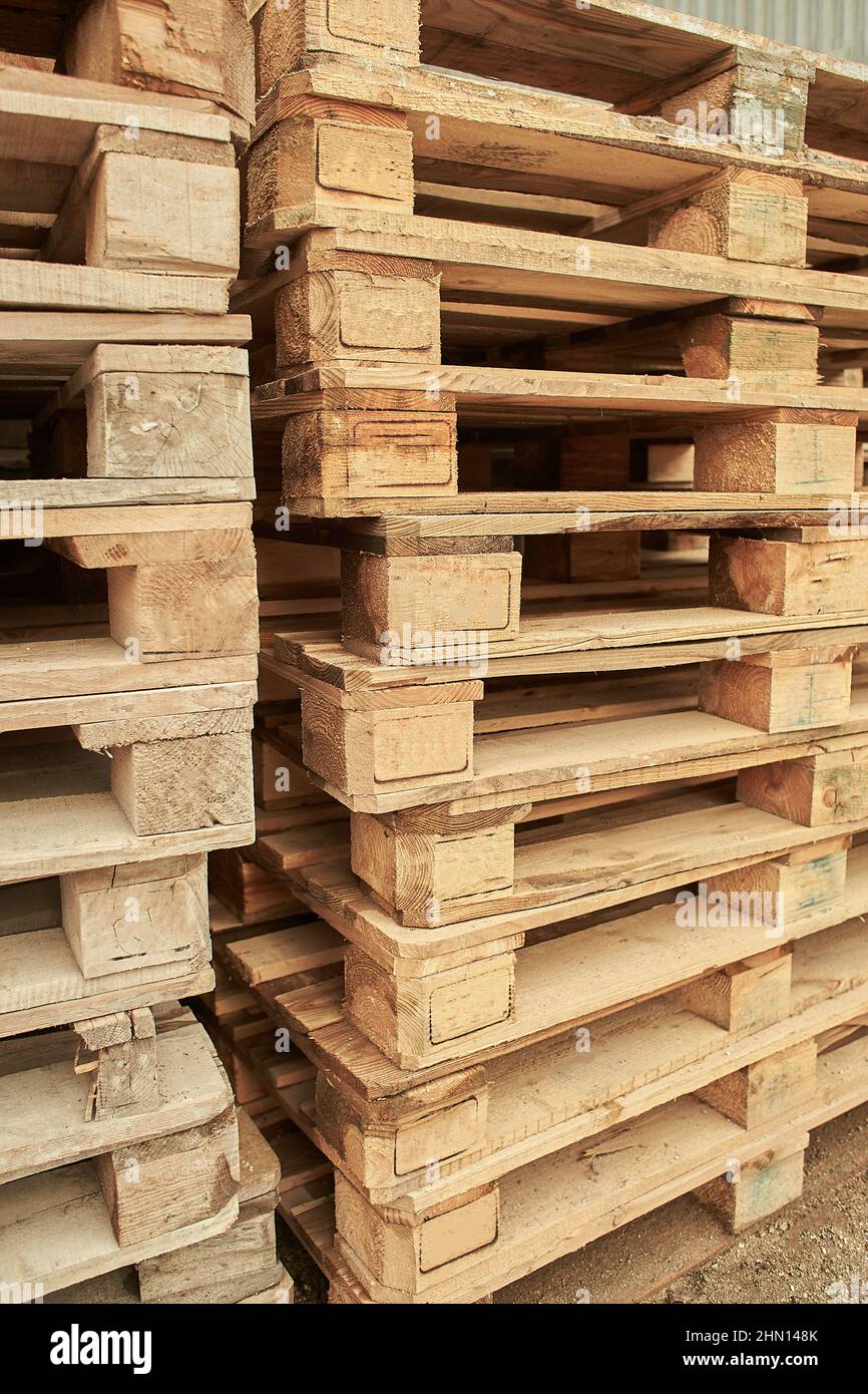 Pile of wooden pallets stacked on top of each other Stock Photo - Alamy