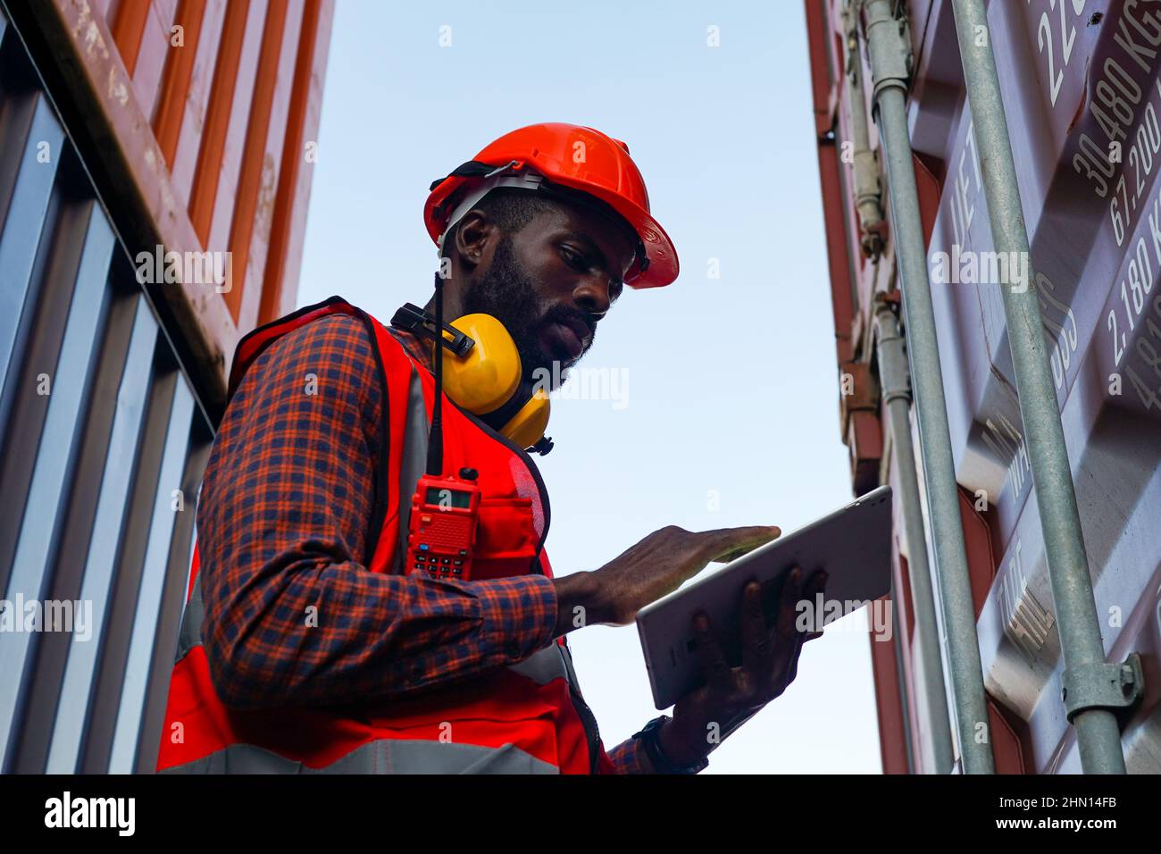 Foreman control loading Containers box from Cargo freight ship for ...