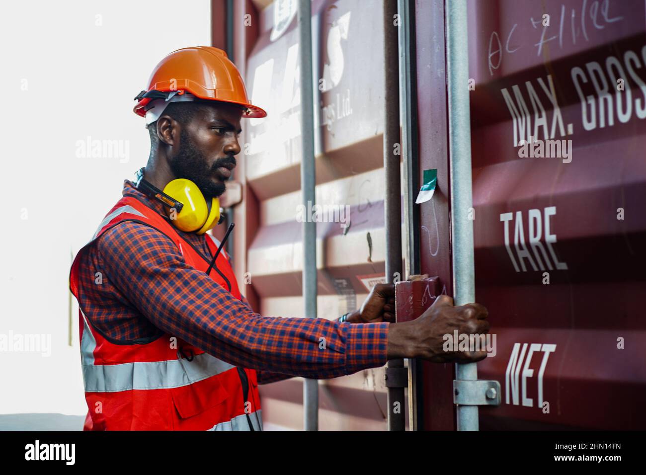 Foreman control loading Containers box from Cargo freight ship for ...