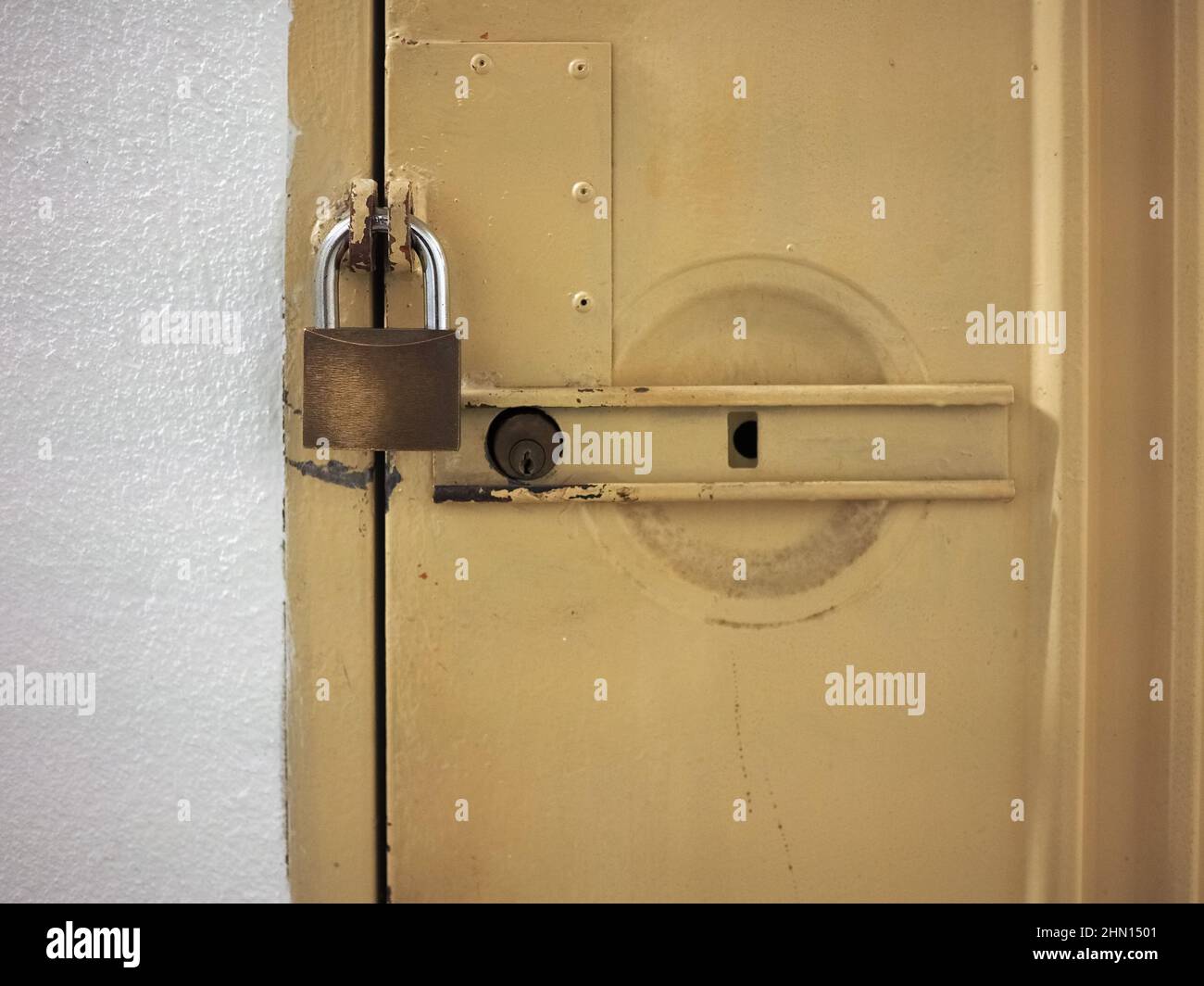 door lock in grunge industrial metal door Stock Photo - Alamy