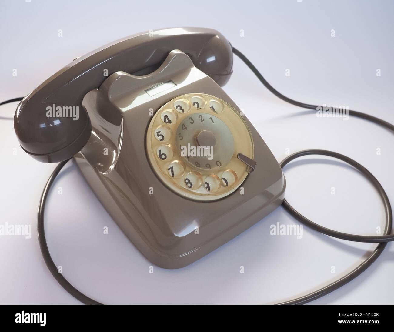 Vintage grey rotary dial analog landline telephone Stock Photo - Alamy