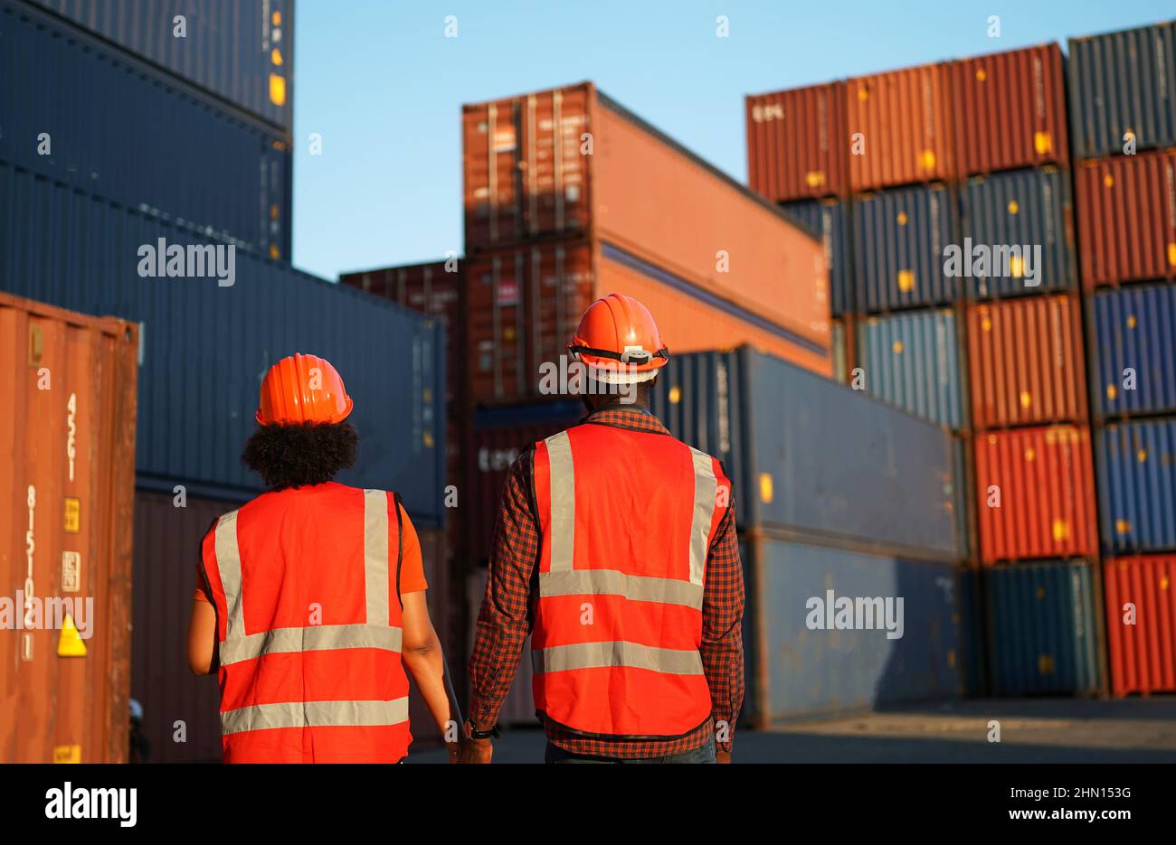 Foreman control loading Containers box from Cargo freight ship for ...