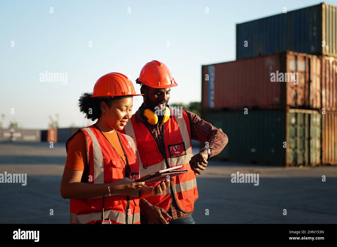 Foreman control loading Containers box from Cargo freight ship for ...