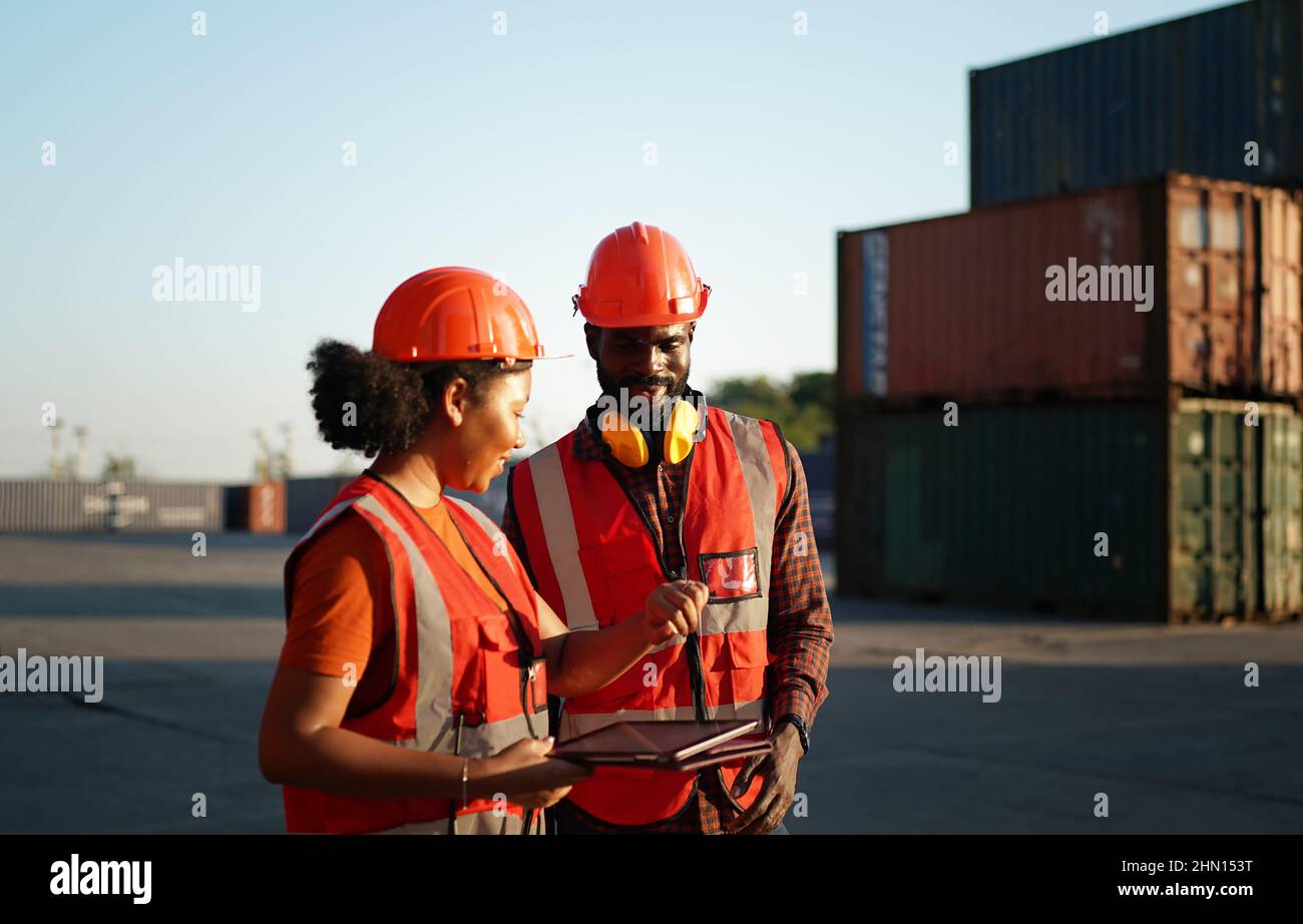 Foreman control loading Containers box from Cargo freight ship for ...