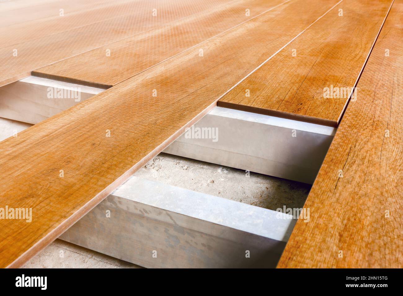 Construction floor installation wooden work flooring wood plank. Repair ...