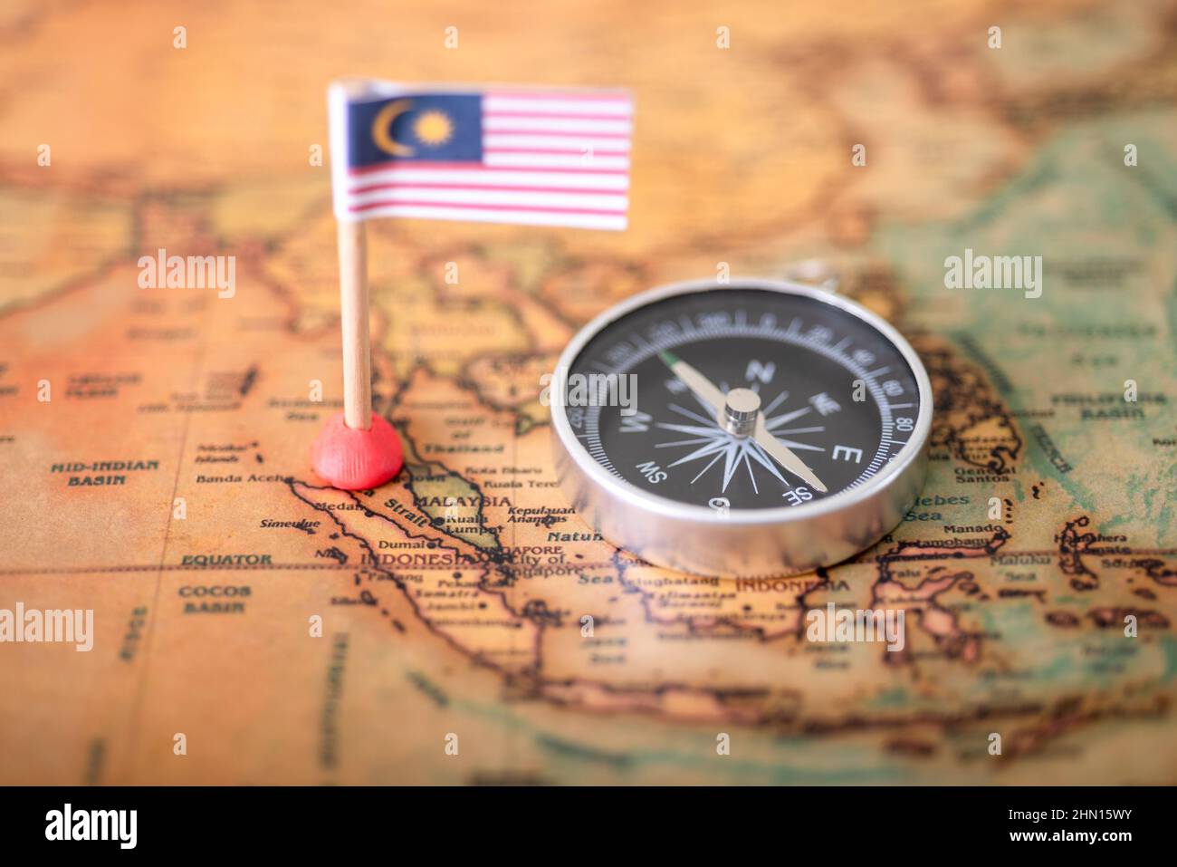 Flag of Malaysia and compass on the world map. The concept of travel ...