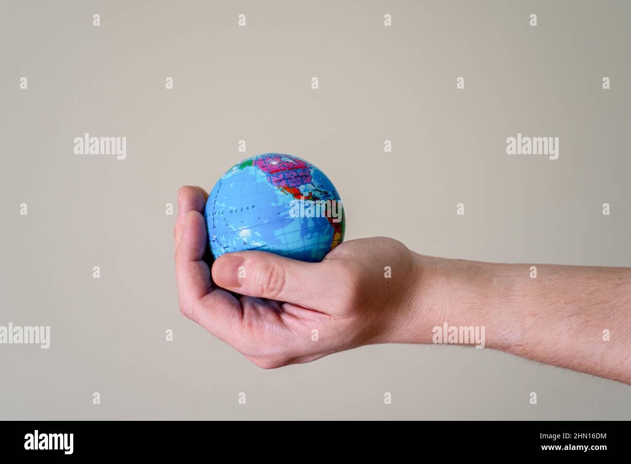 Male, holding the planet earth at arm's length. The concept of planet ...