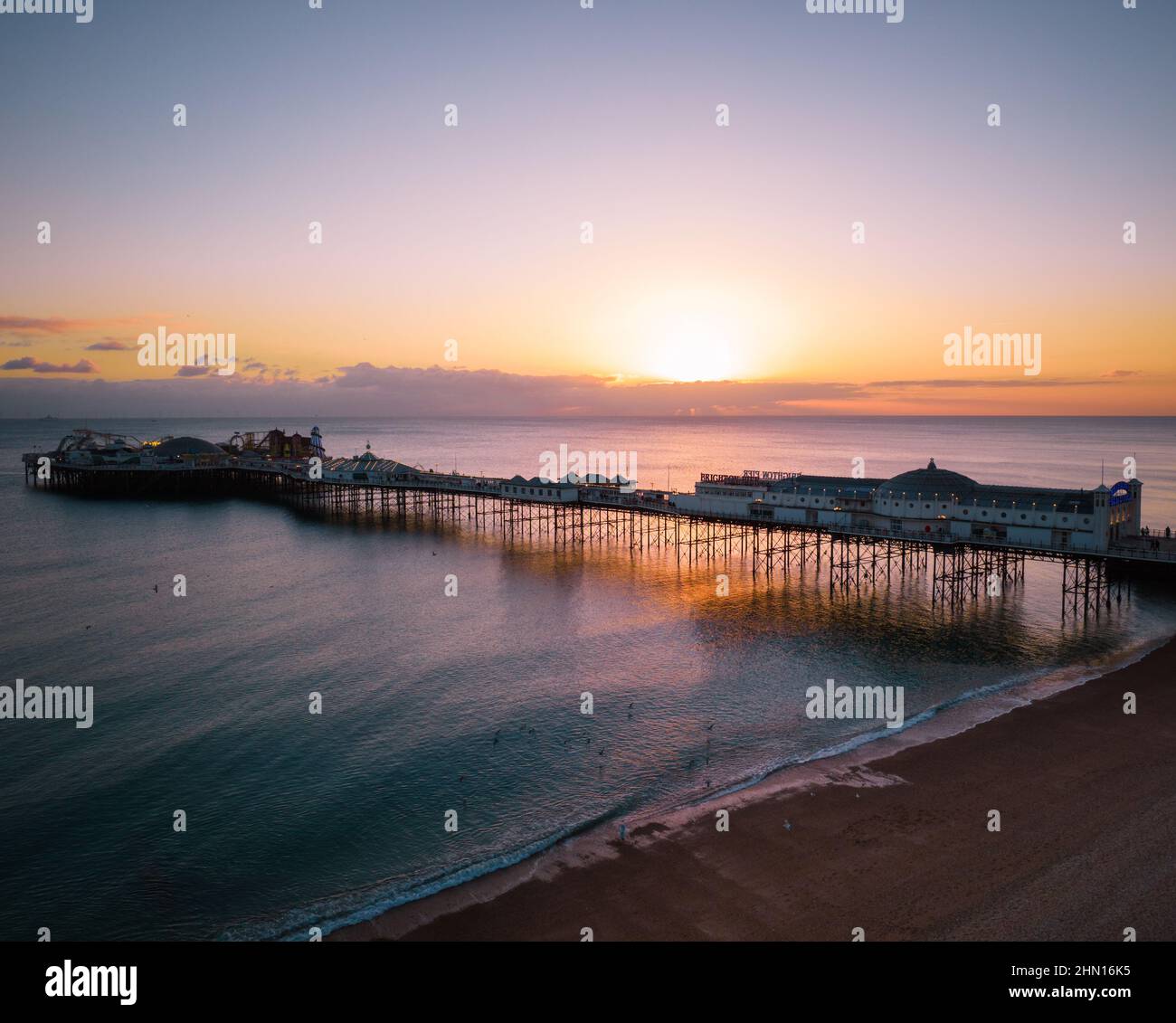 Brighton pier at sunset Stock Photo - Alamy