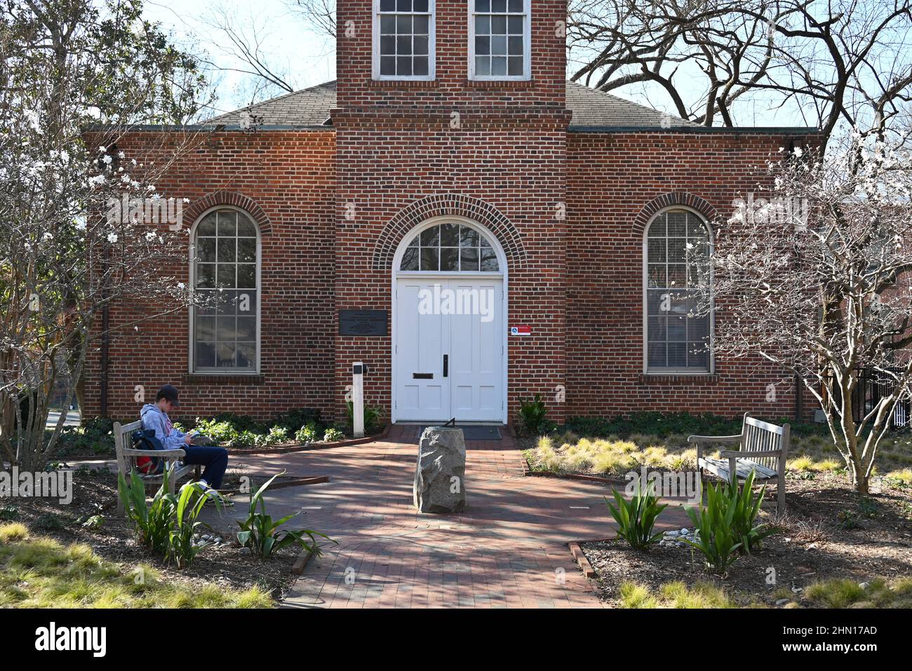 A student studies in front of Primrose Hall, one of the original ...