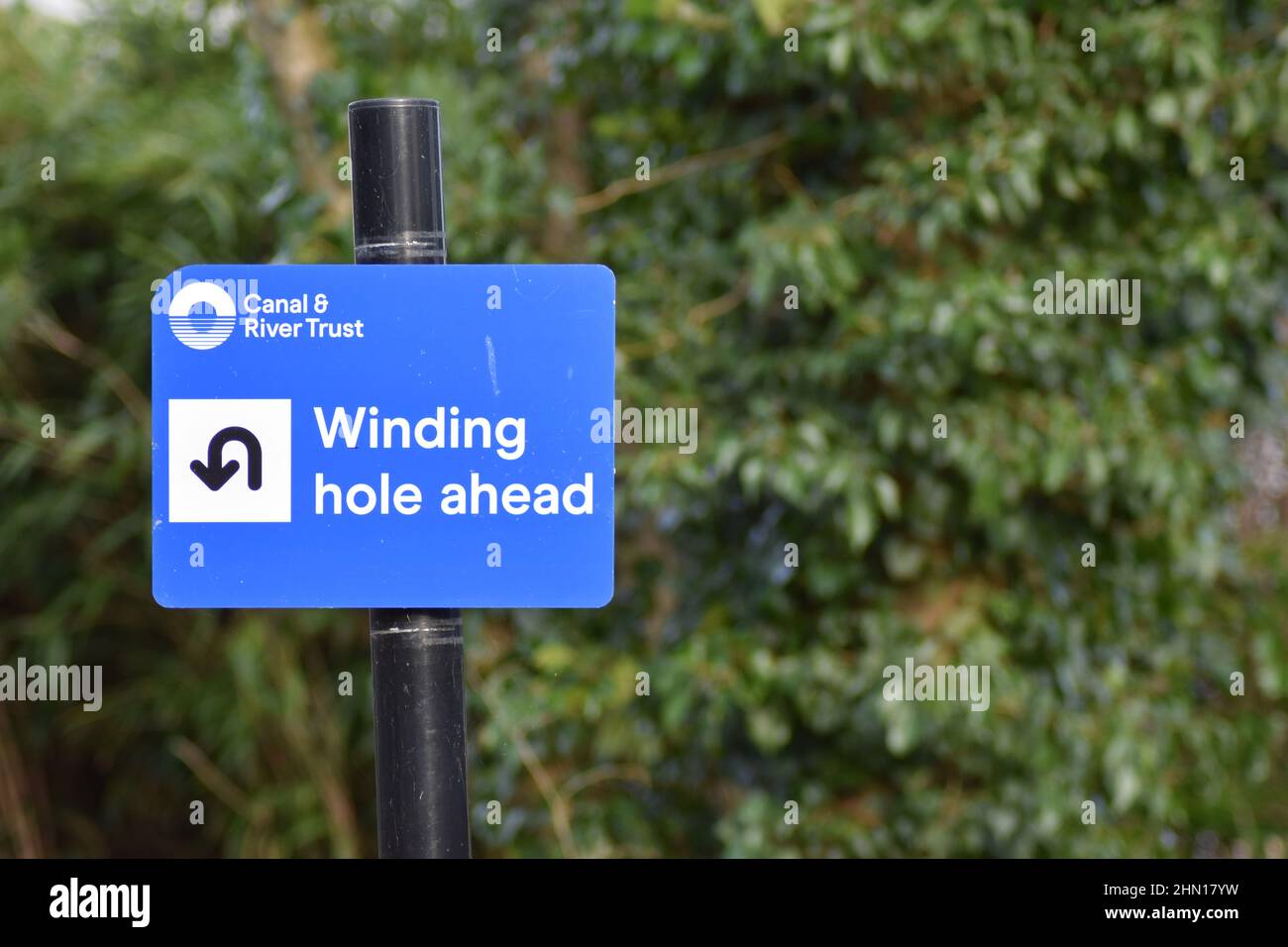 A sign on the Grand Union Canal: "Winding hole ahead". This is a wide ...