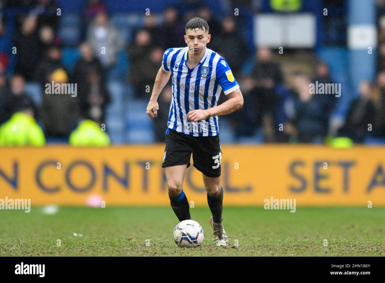 Jordan Storey #38 of Sheffield Wednesday runs forward with the ball ...