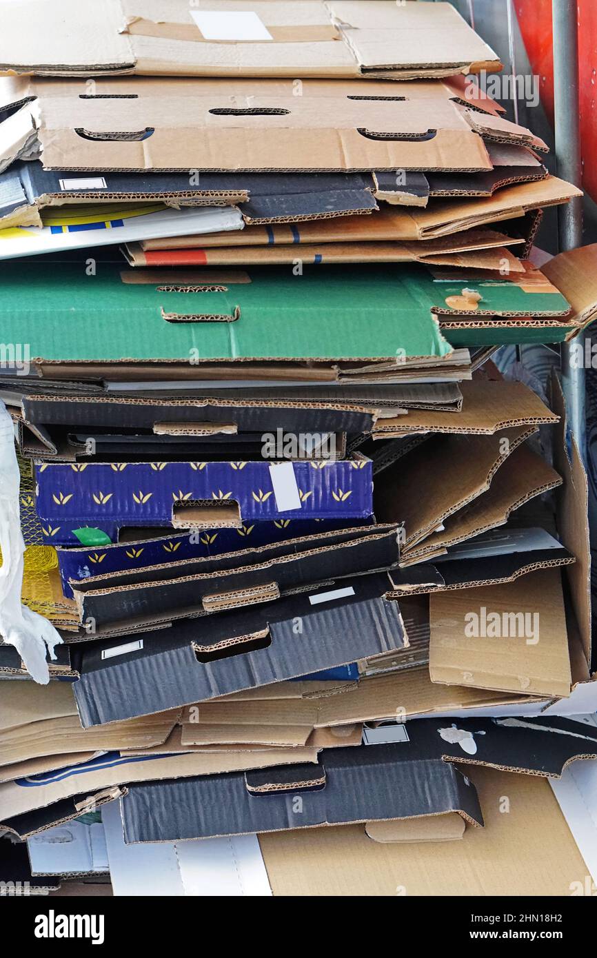 Stacked cardboard carton paper for recycling material Stock Photo - Alamy