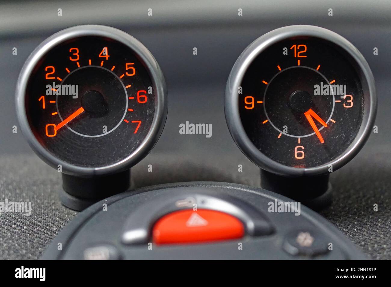 Analog car odometer and clock dashboard gauges with orange lights Stock ...