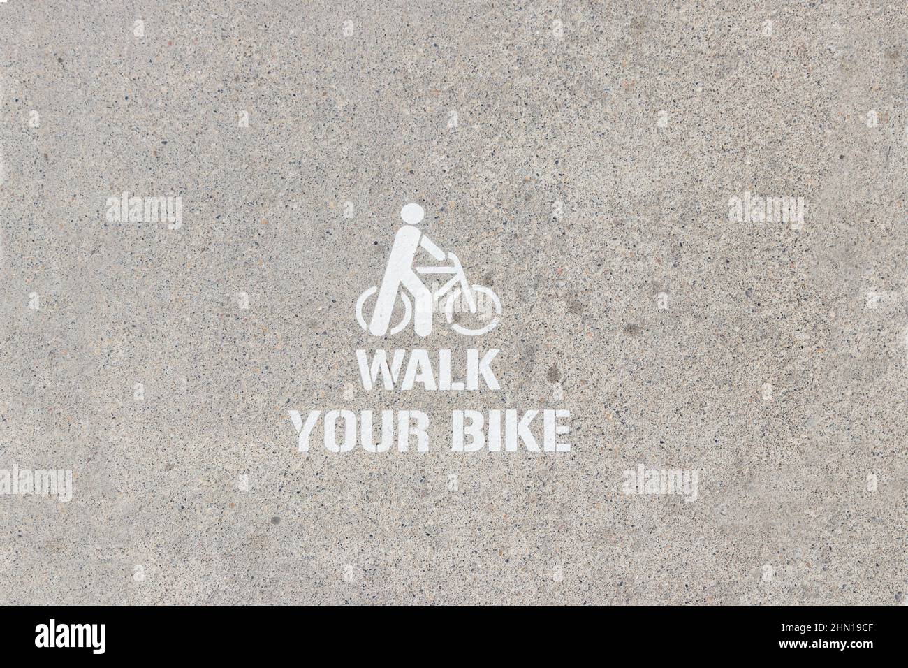 walk your bike painted sign on road pavement surface in canada Stock ...