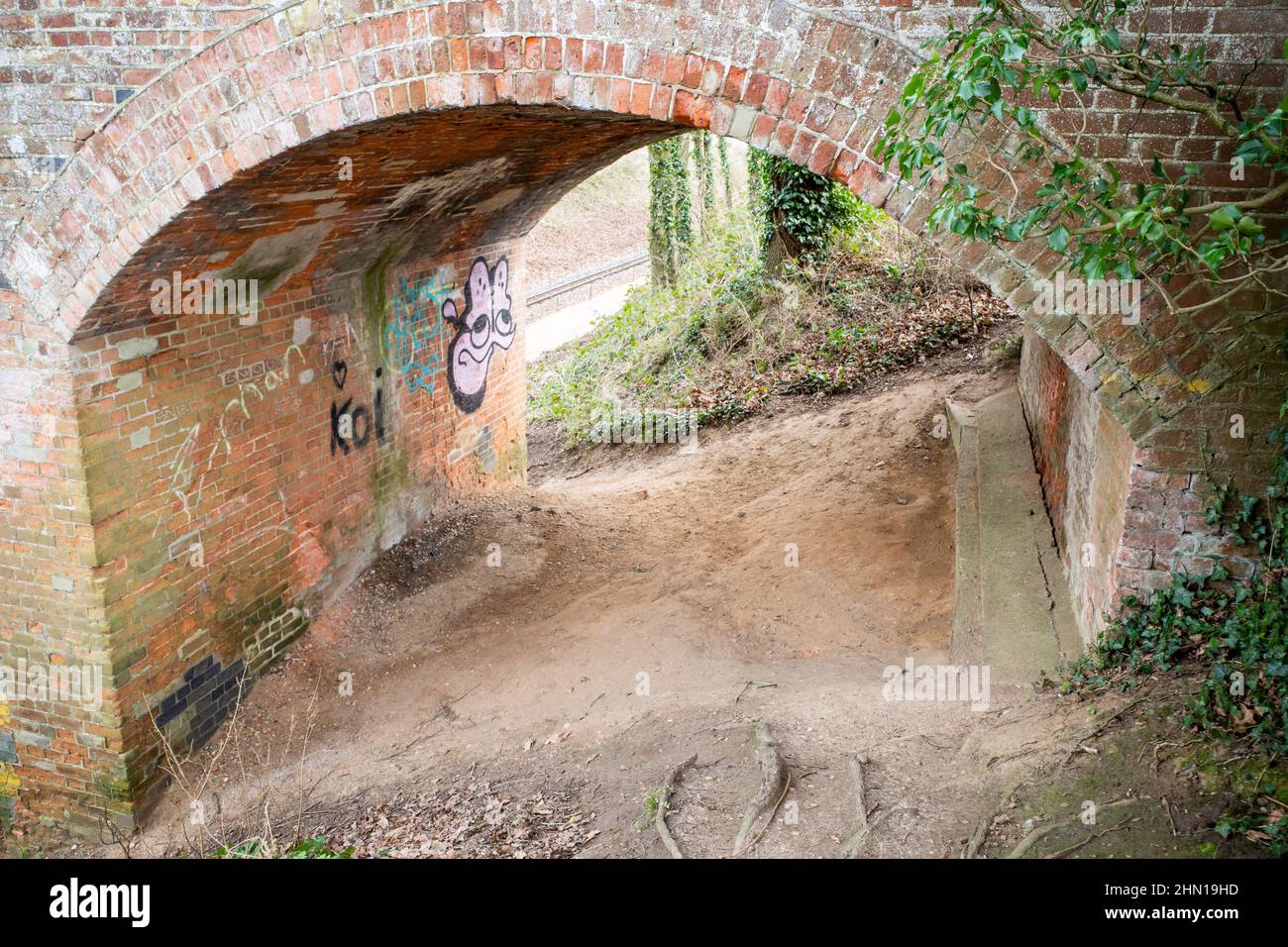Bridge constructed from red brick over the Bure Valley Railway line in ...