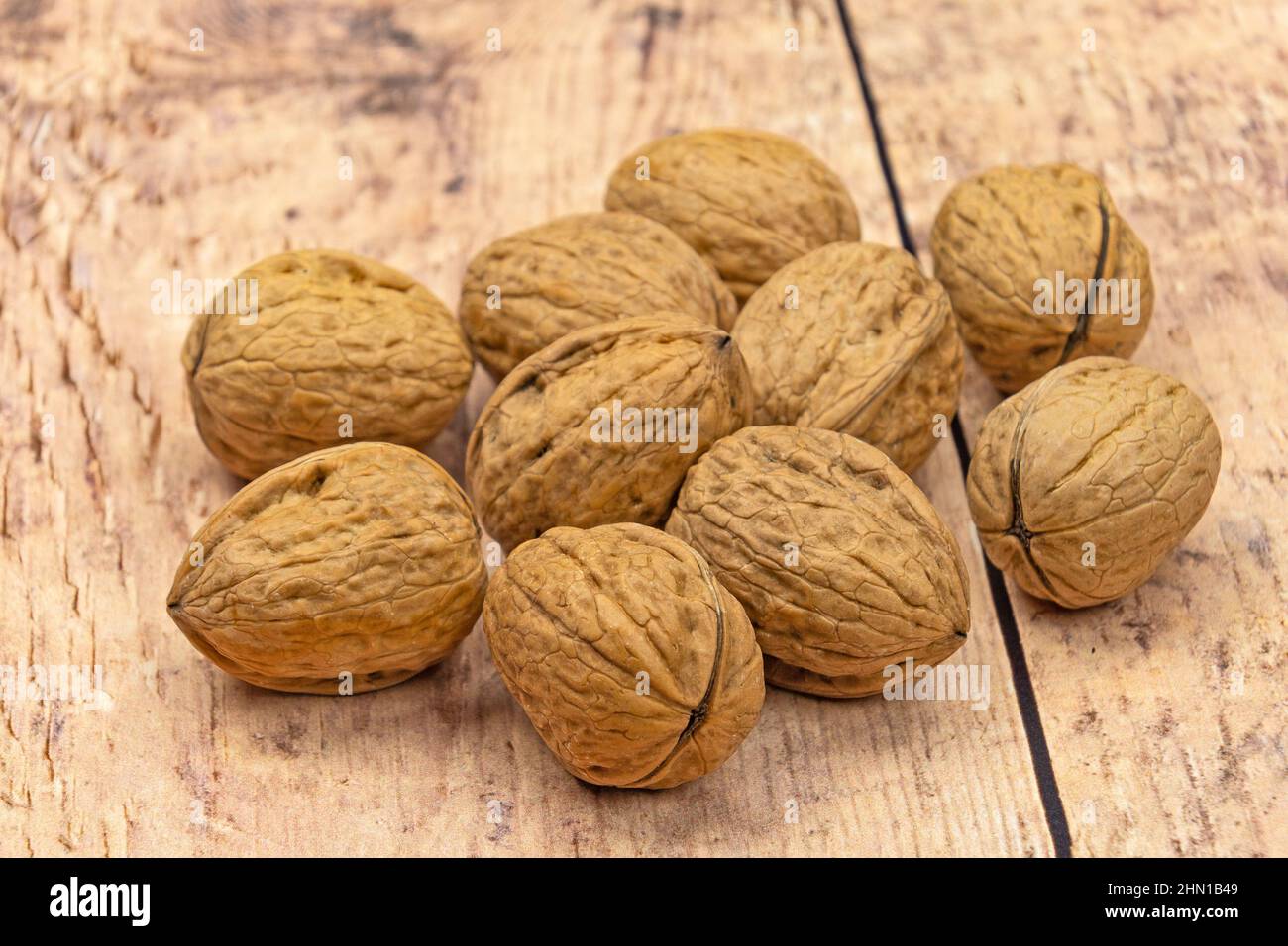 fresh walnut on a wooden background Stock Photo - Alamy