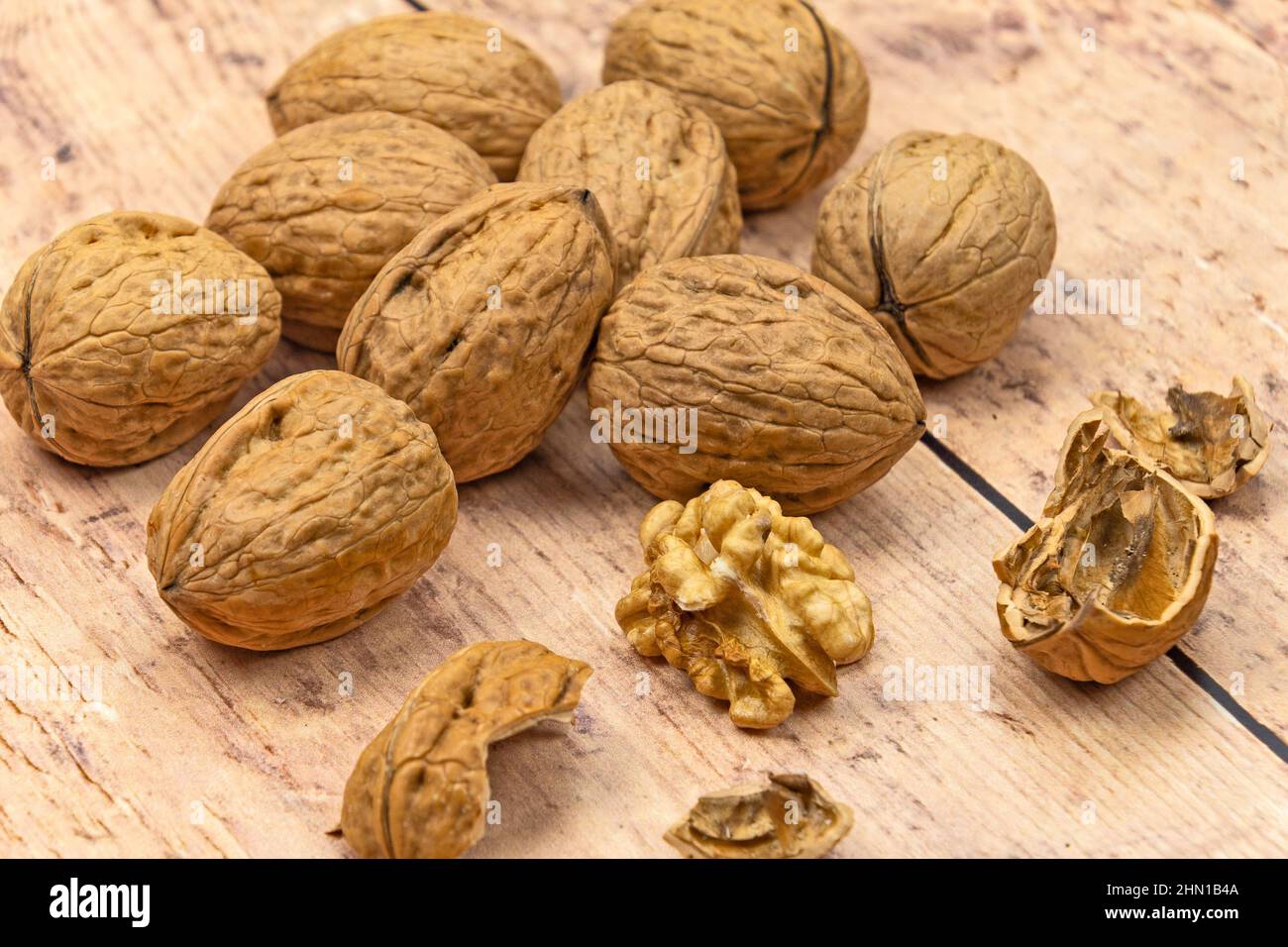 fresh walnut on a wooden background Stock Photo - Alamy