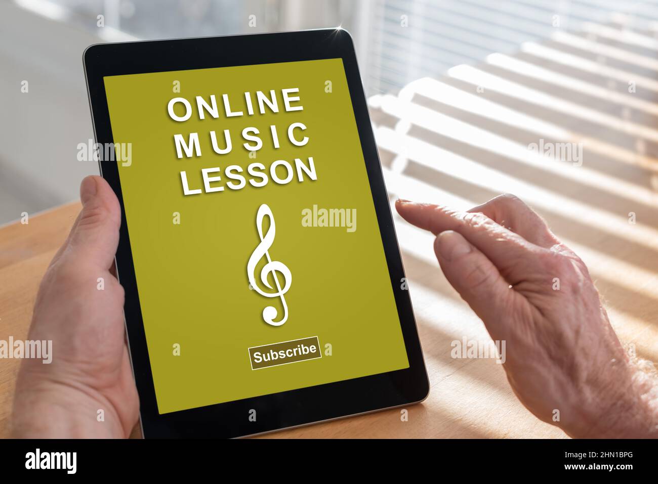 Tablet screen displaying an online music lesson concept Stock Photo - Alamy