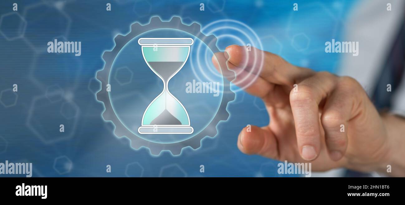Man touching a time management concept on a touch screen with his ...