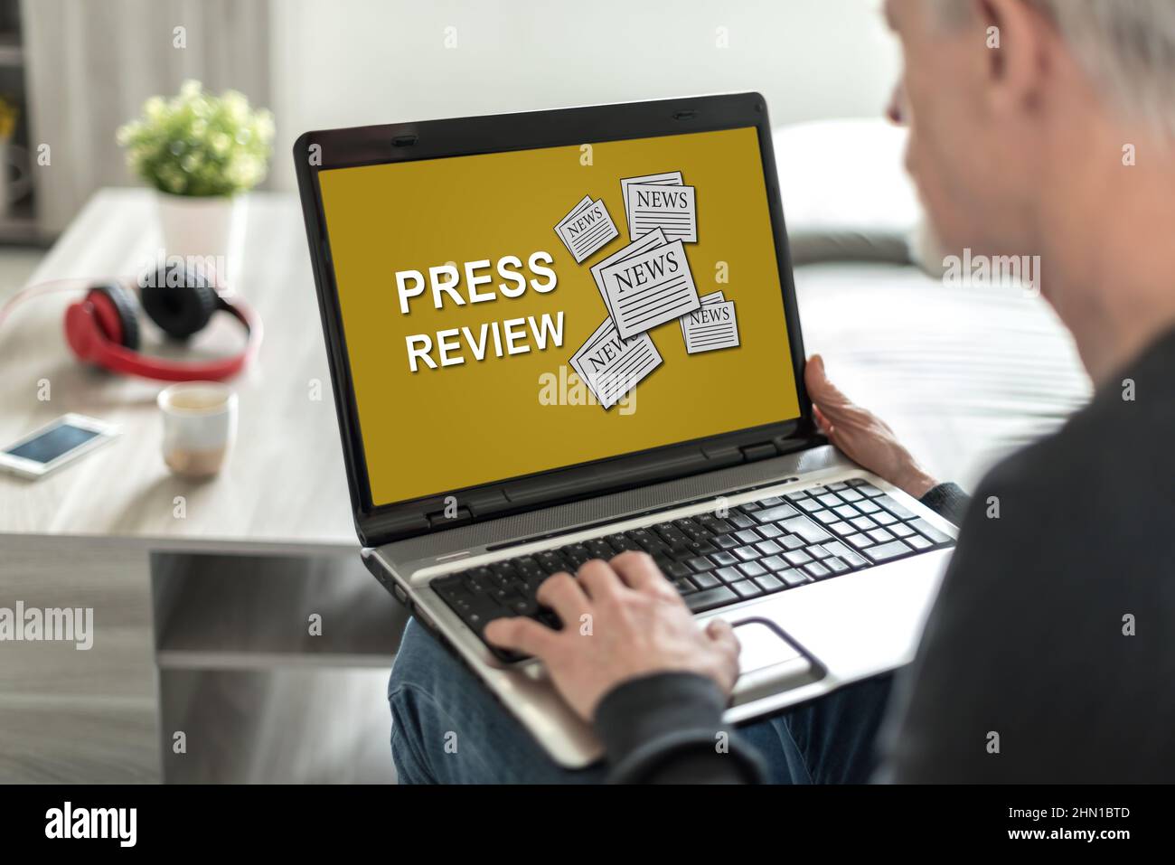 Laptop screen displaying a press review concept Stock Photo - Alamy