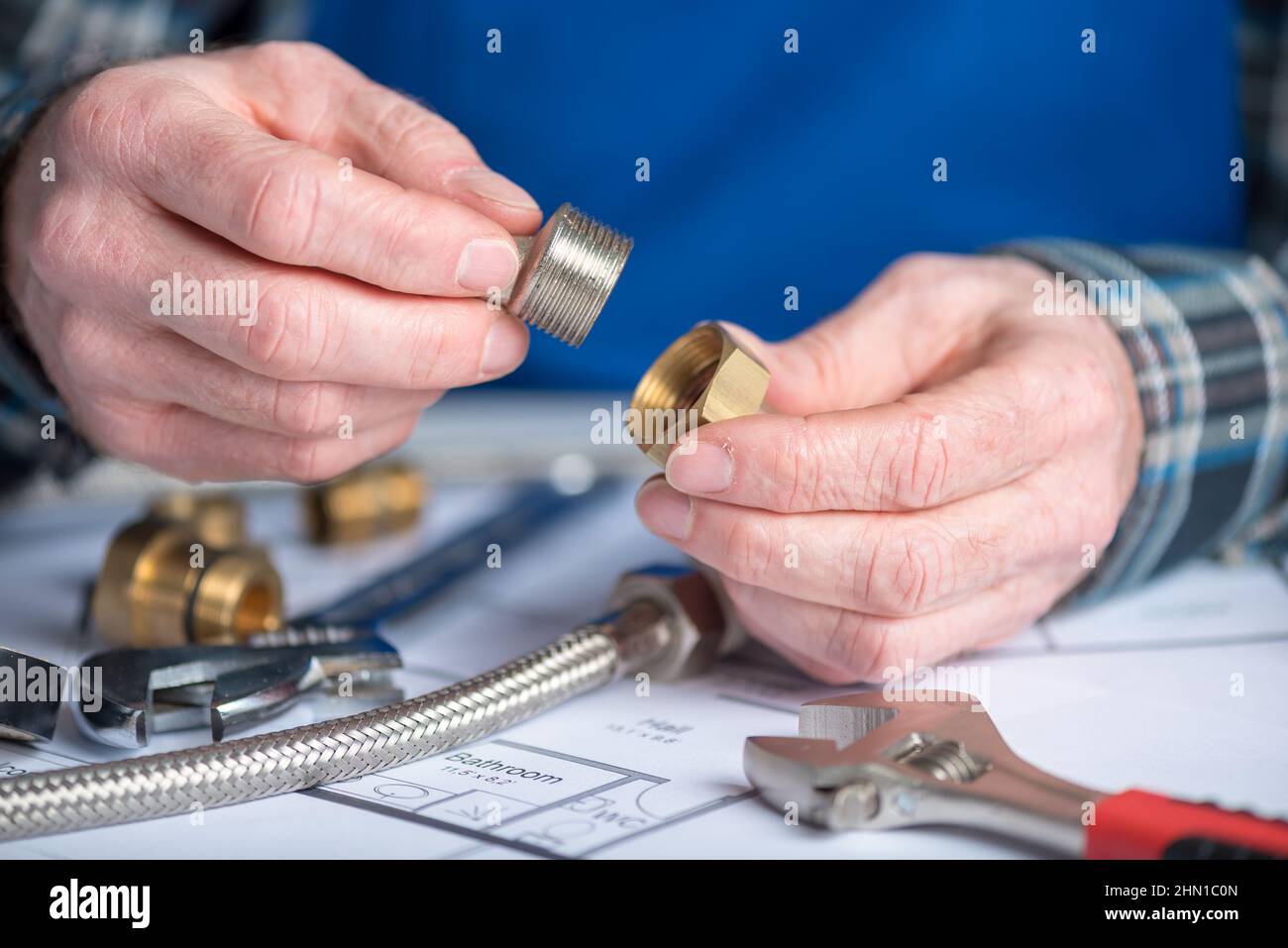 Repair plumbing hands using hi-res stock photography and images - Alamy