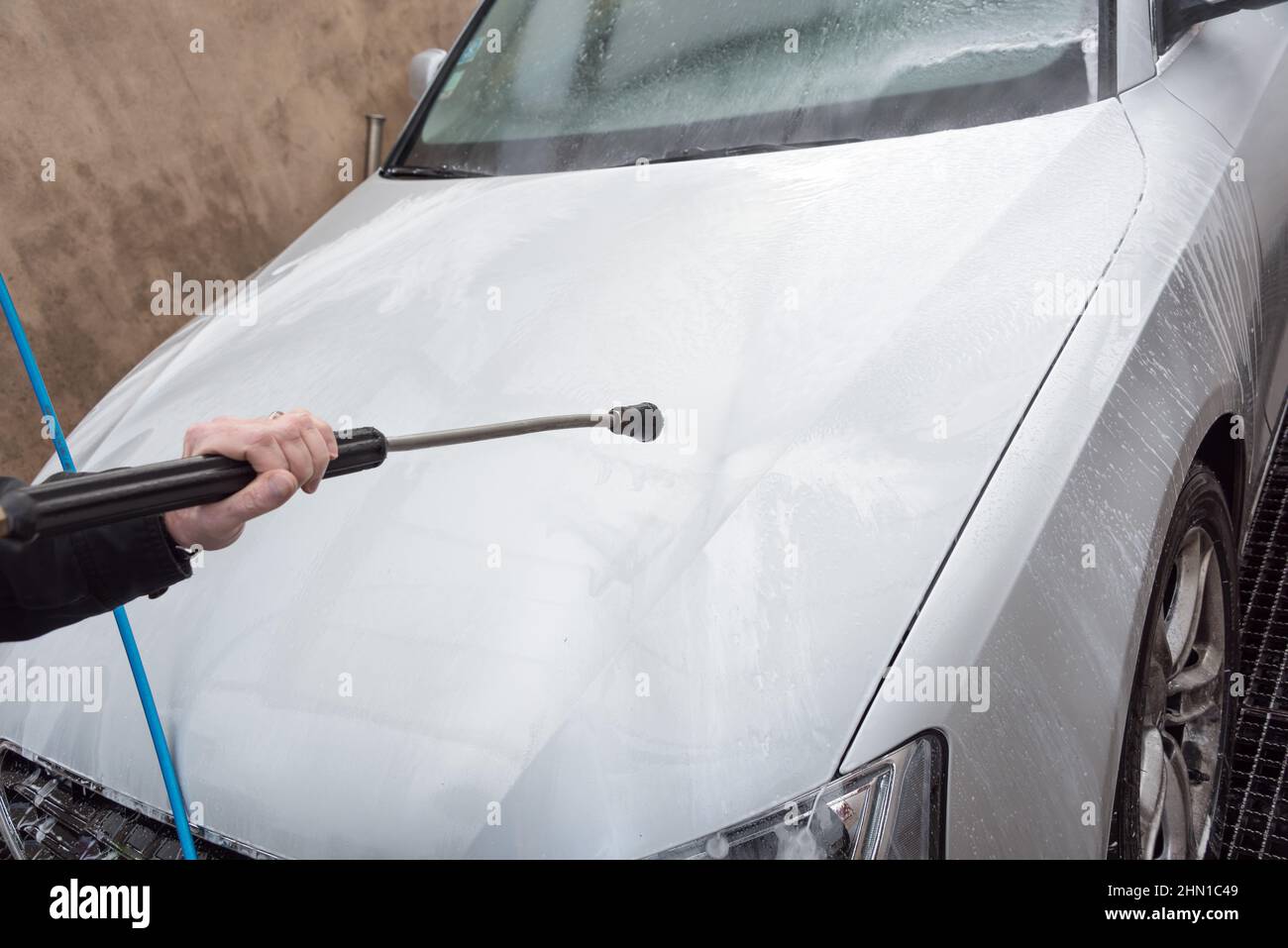 Car washing with a high pressure water jet Stock Photo - Alamy