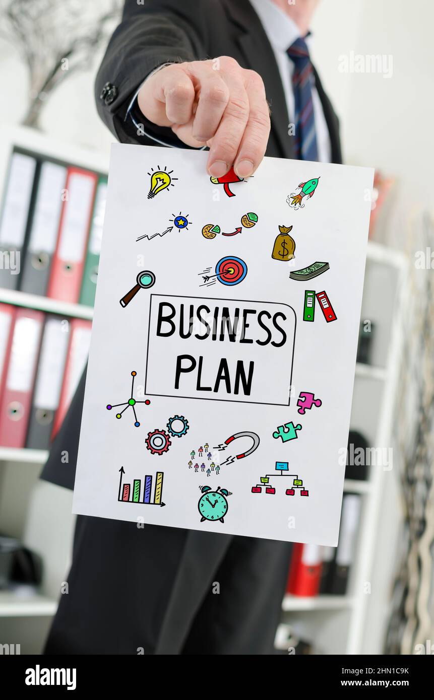 Paper showing business plan concept held by a businessman Stock Photo ...