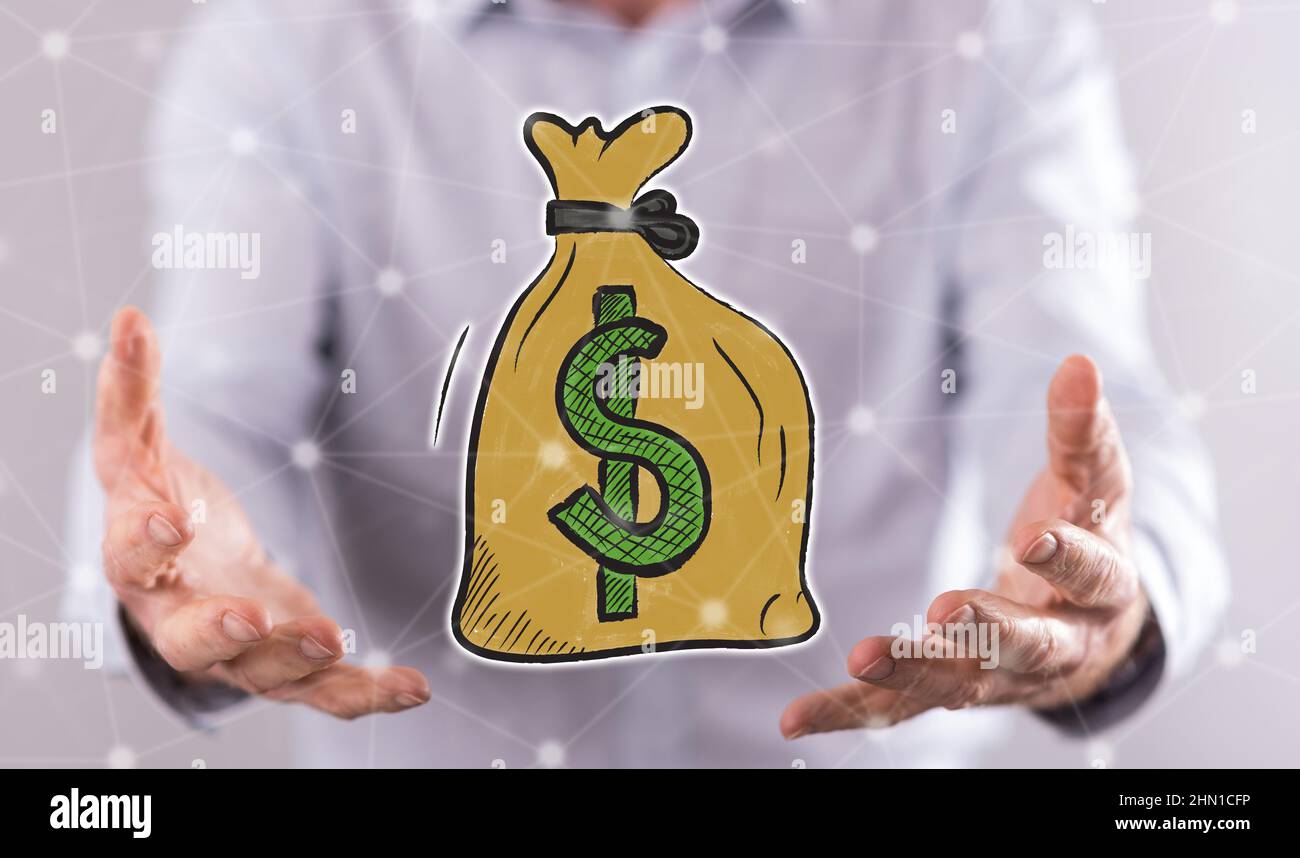Money concept above the hands of a man in background Stock Photo - Alamy