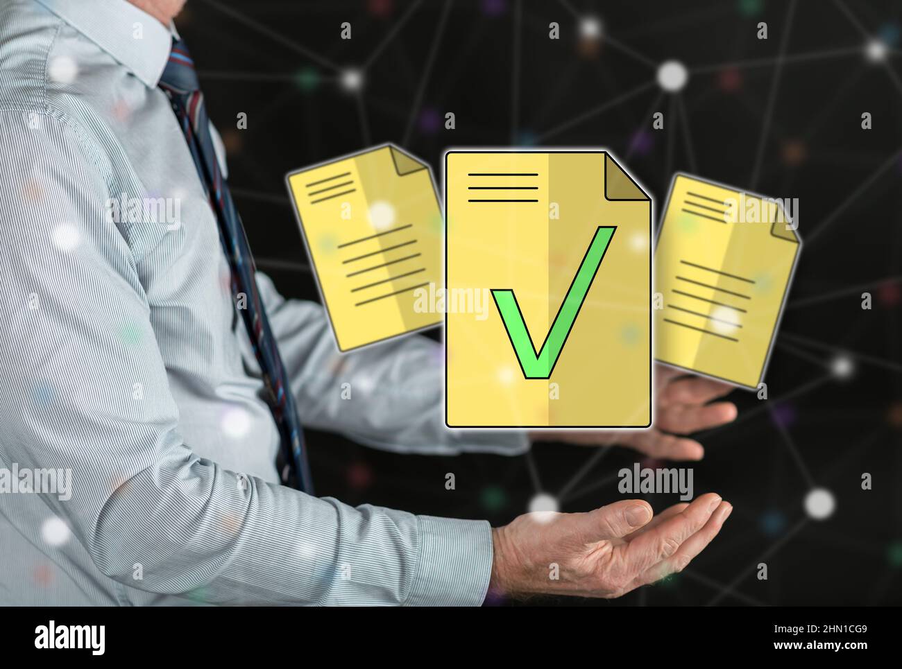 Document validation concept above the hands of a man Stock Photo - Alamy
