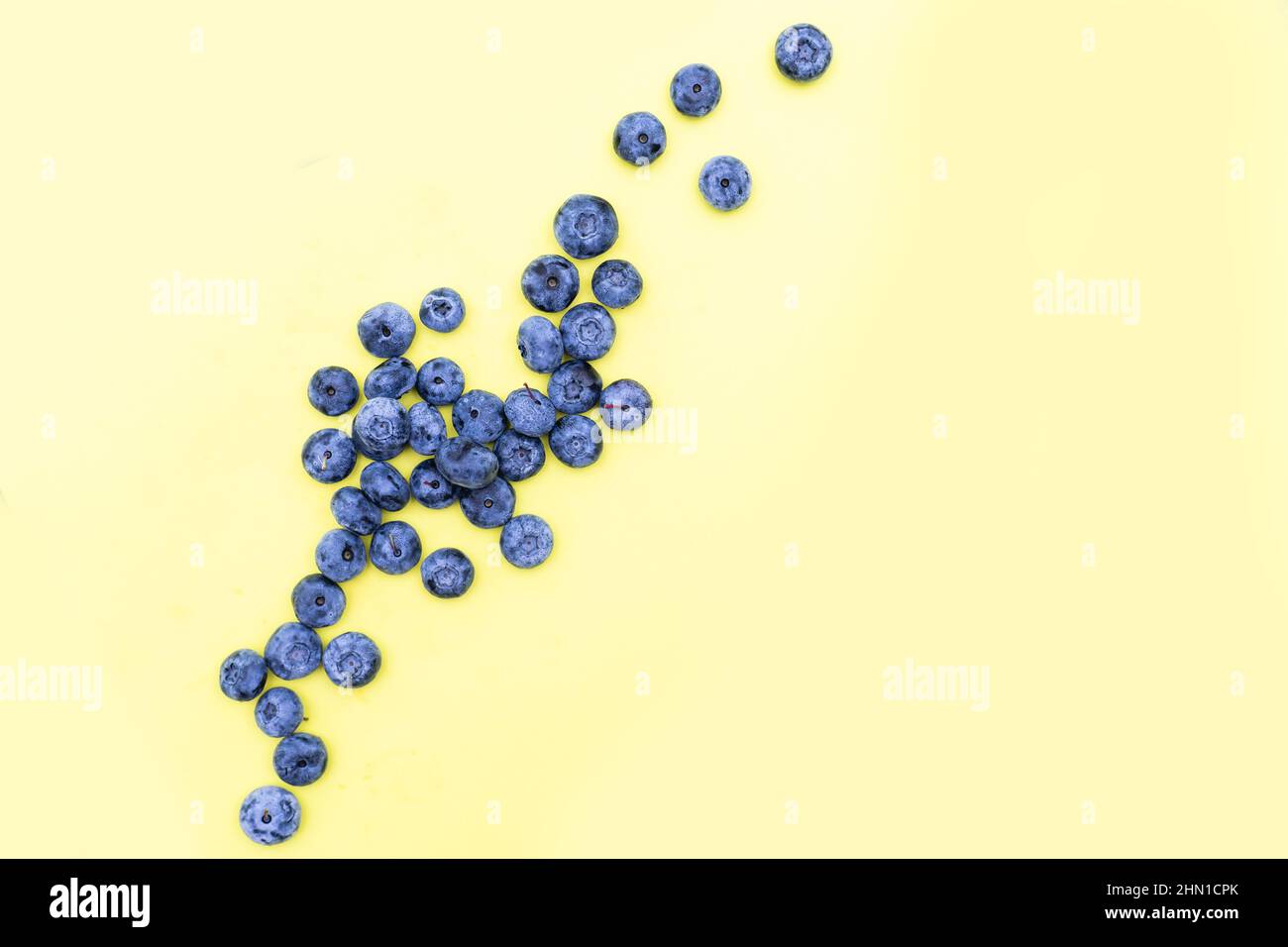 Blueberries. Blueberry isolate on yellow. Top view Stock Photo - Alamy
