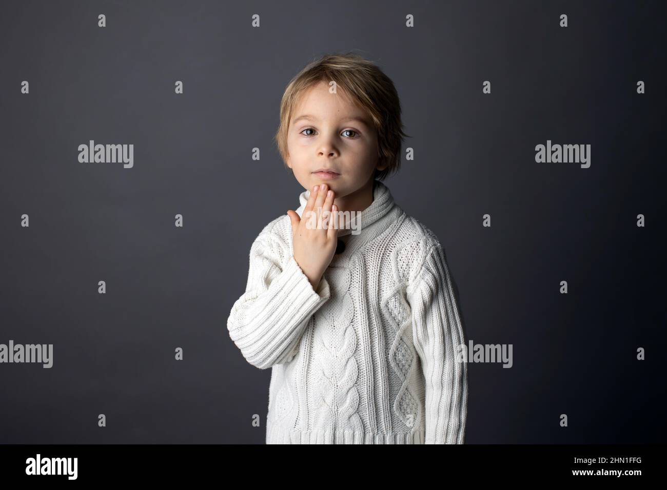 Cute little toddler boy, showing THANK YOU gesture in sign language on ...
