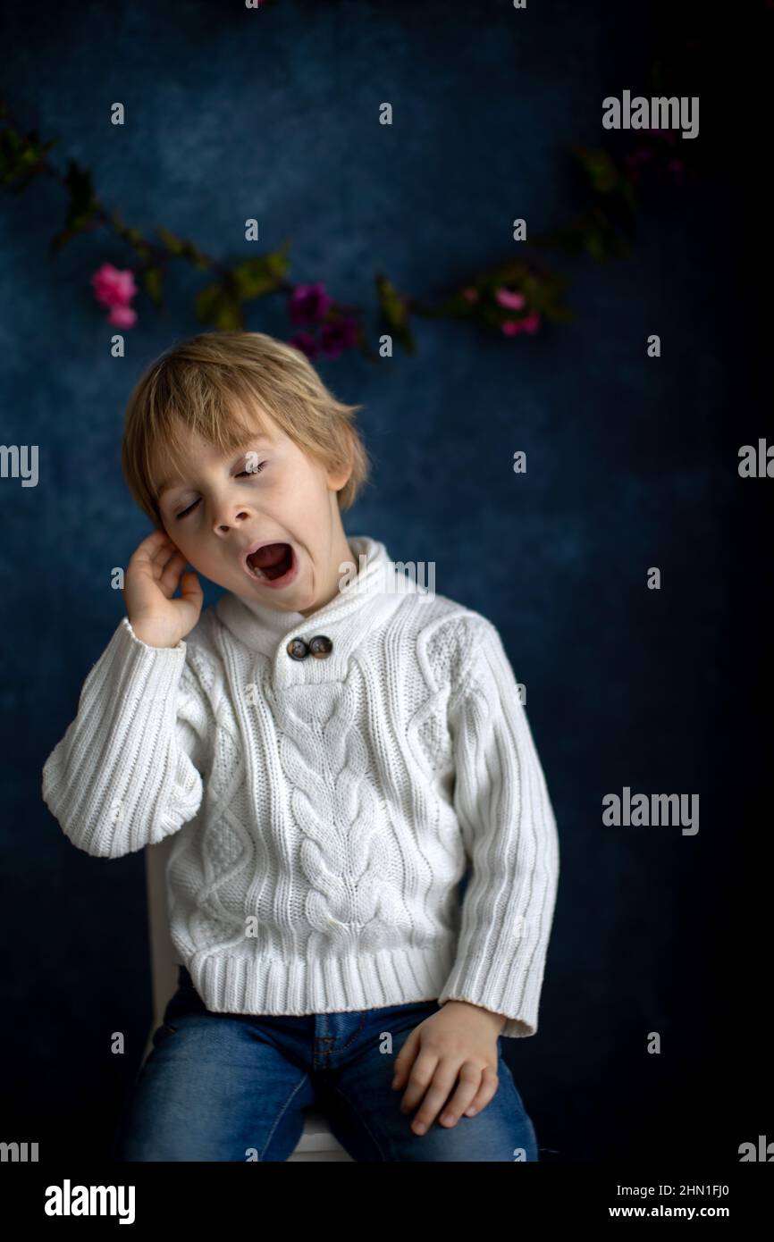 Cute little toddler boy, showing gesture in sign language on blue ...