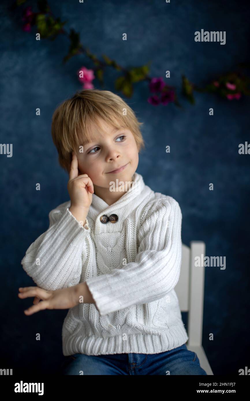 Cute little toddler boy, showing gesture in sign language on blue ...