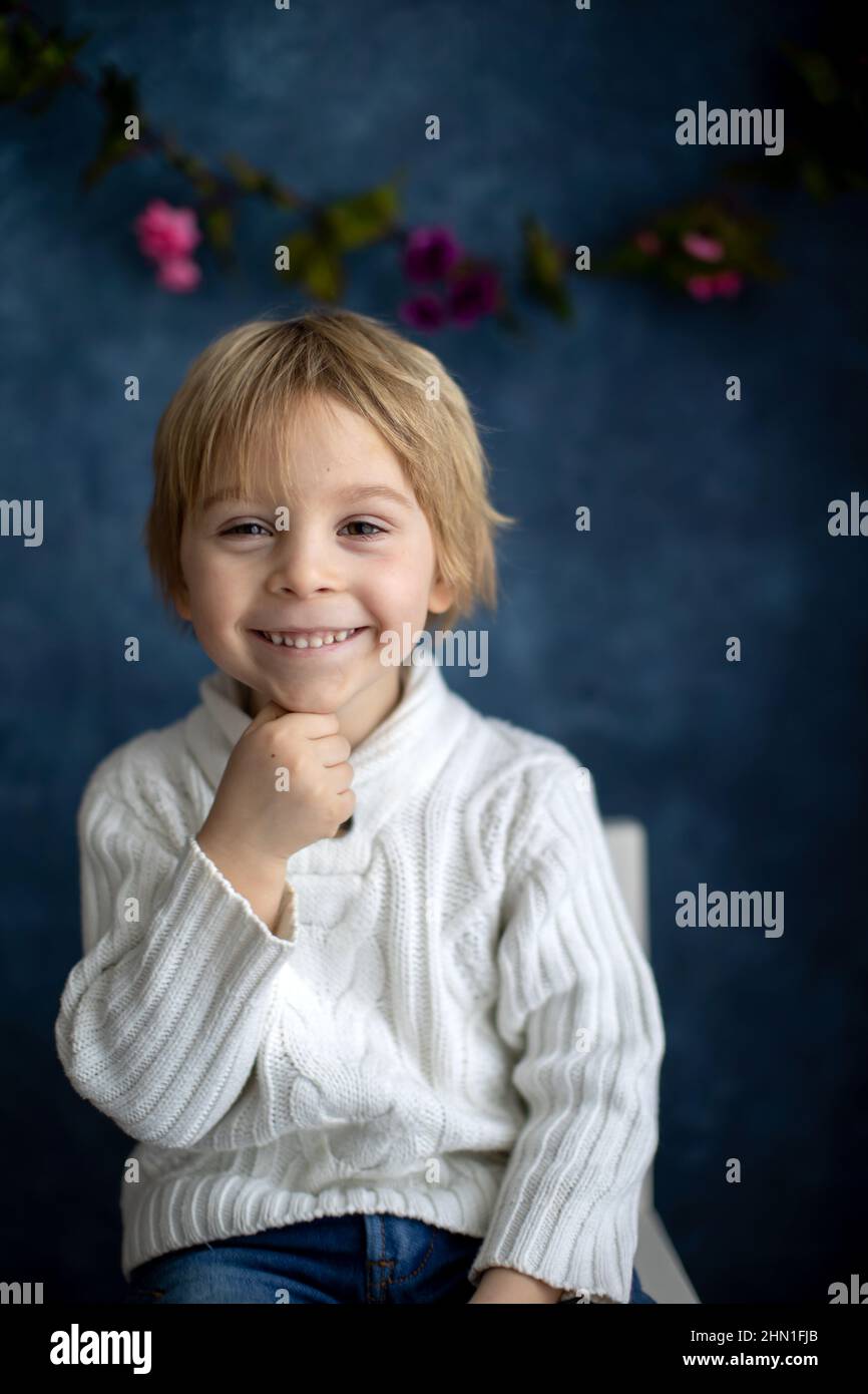 Cute little toddler boy, showing gesture in sign language on blue ...