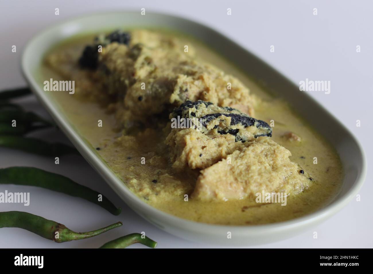 Kerala style, coconut based Pomfret fish curry. Yellow coloured fish ...