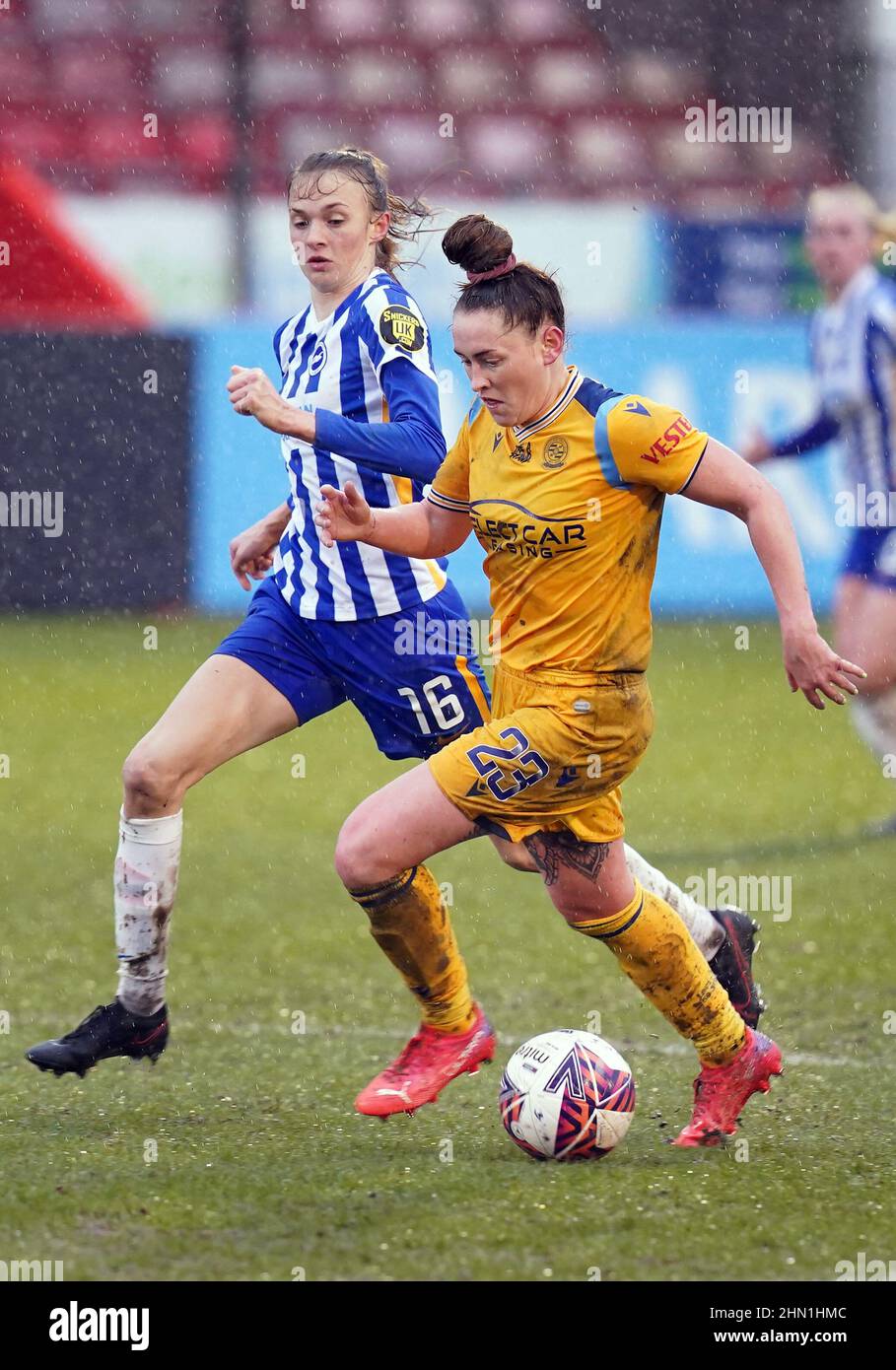 Brighton and Hove Albion's Ellie Brazil (left) challenges Reading's ...
