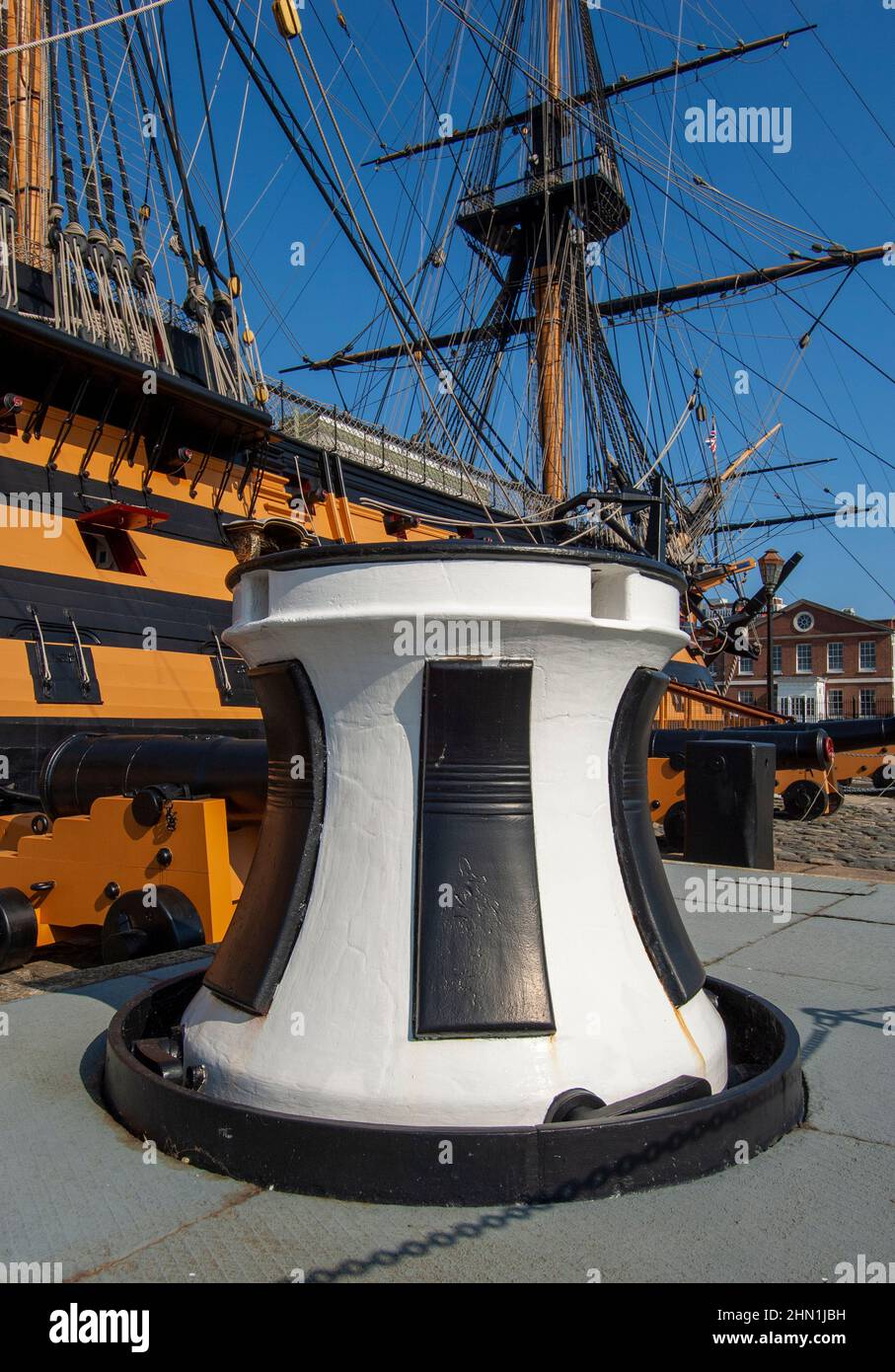 A quayside capstan in the Portsmouth Historic Dockyard with HMS Victory ...