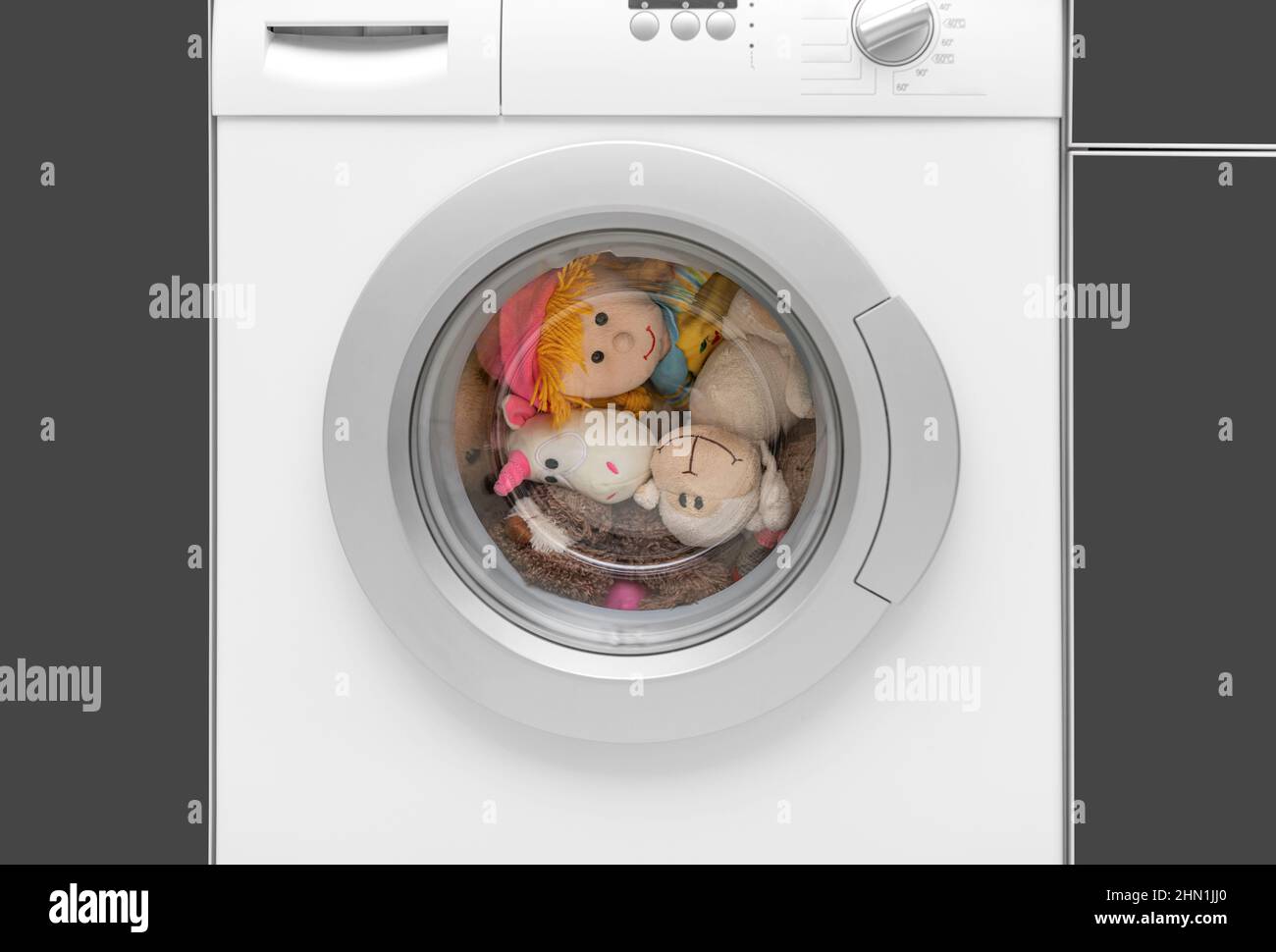 Children's toys in the washing machine Stock Photo - Alamy