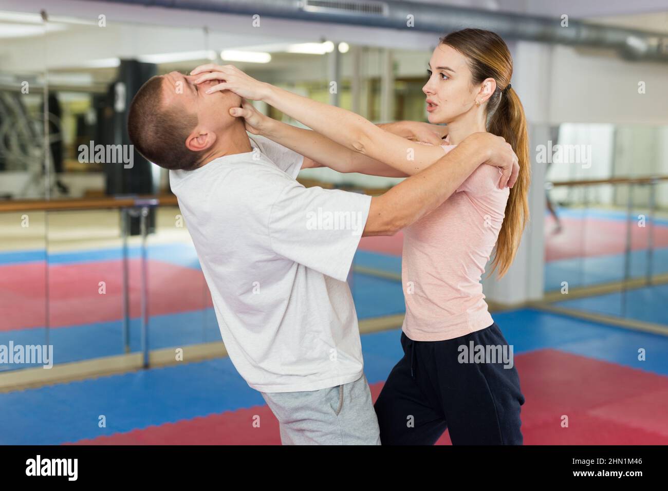 Self-defense course - woman strikes painful blow in the eyes of man ...
