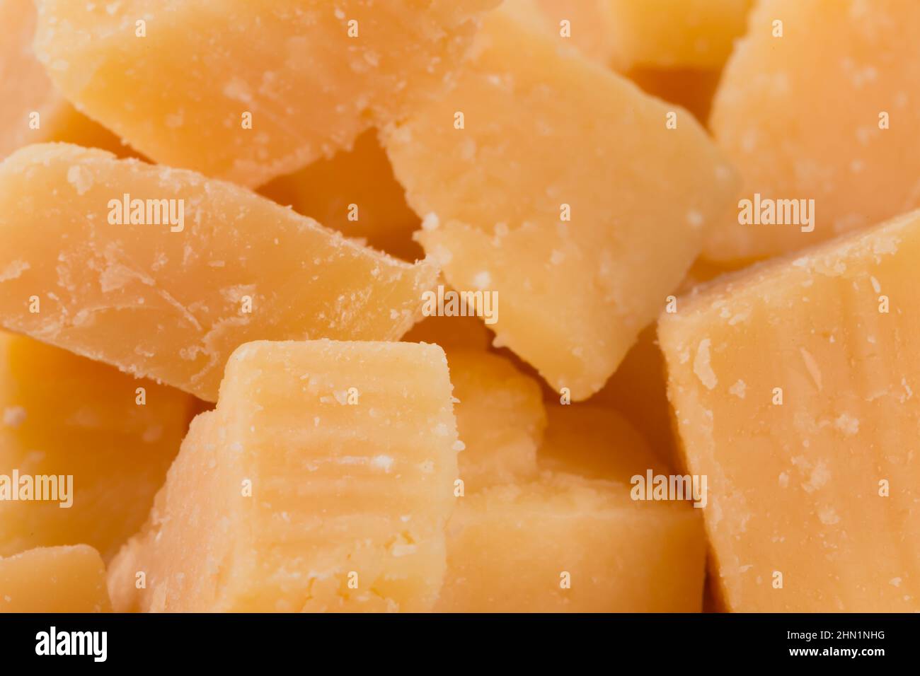 Hard old cheese close up for background Stock Photo - Alamy