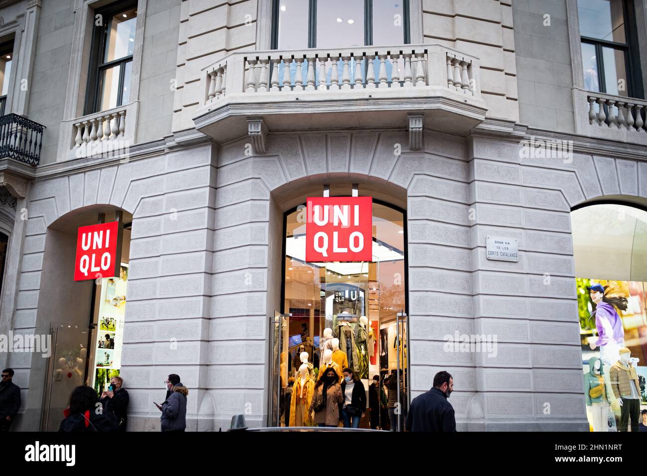 Spain. 12th Feb, 2022. People passes by a Uniqlo clothing and apparel ...