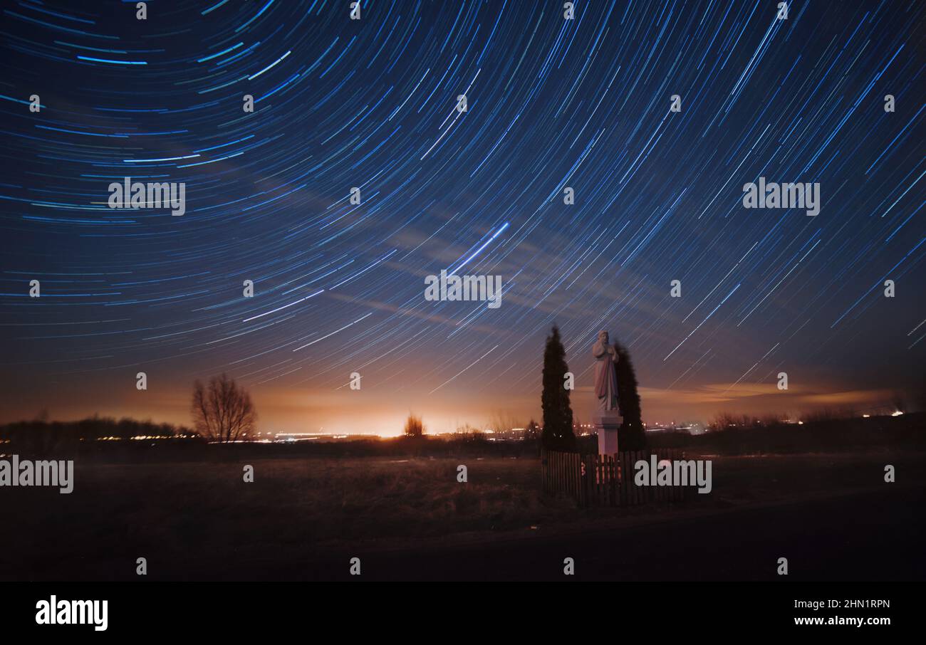 Landscape of a field under a starry sky with long exposure in the ...