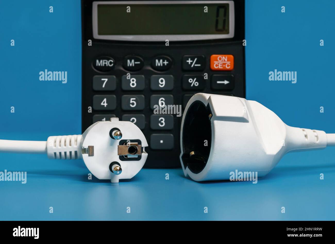 Electricity growth concept. Calculator and AC power plug Stock Photo ...