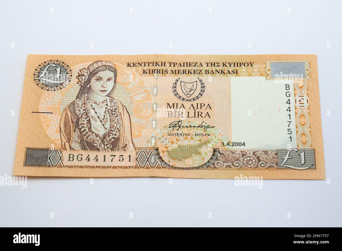 Cypriot girl in traditional costume, one cypriot pound banknote ...