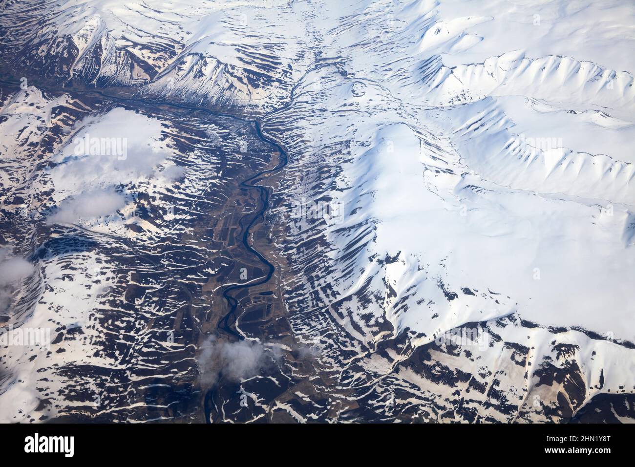 Iceland, aerial view from airplane, showing snow covered mountains ...