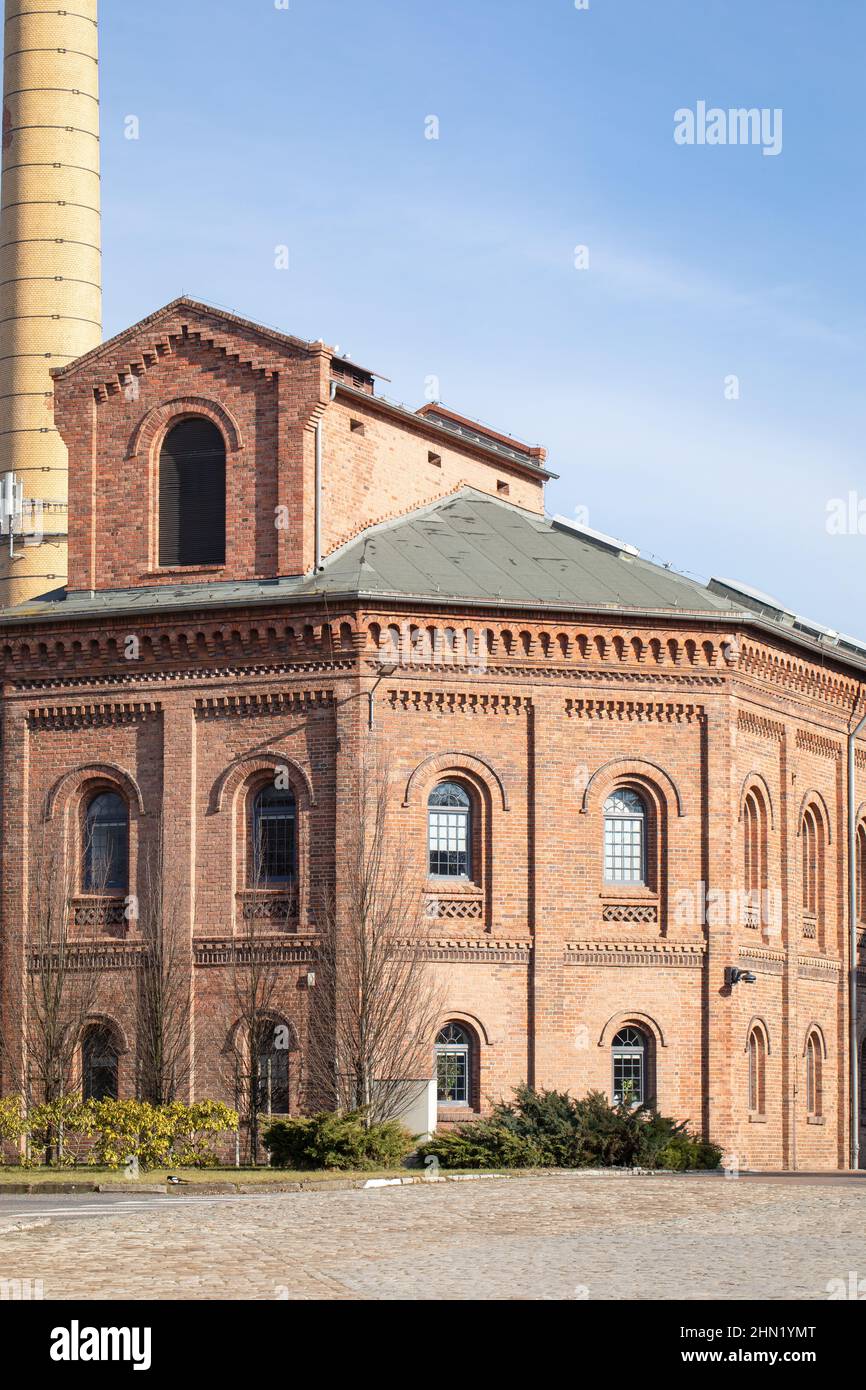 Old gasworks building, red brick architecture in the city, Poznan ...
