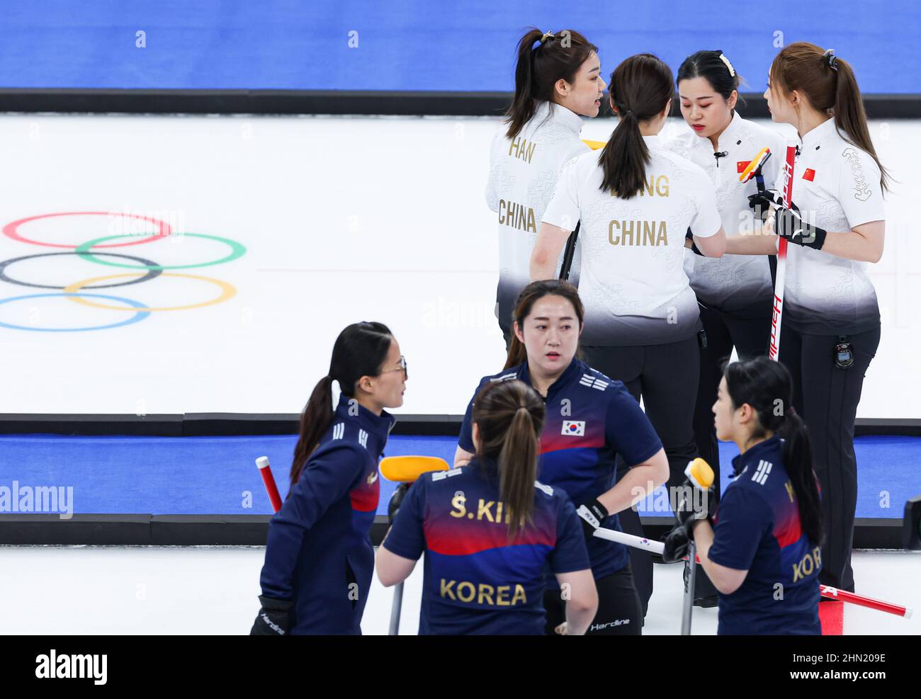 Beijing, China. 13th Feb, 2022. Team China (top) and Team South Korea ...
